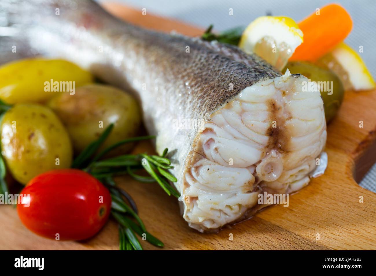 Tail of hake by rustically frying and served with boiled potatoes and ...