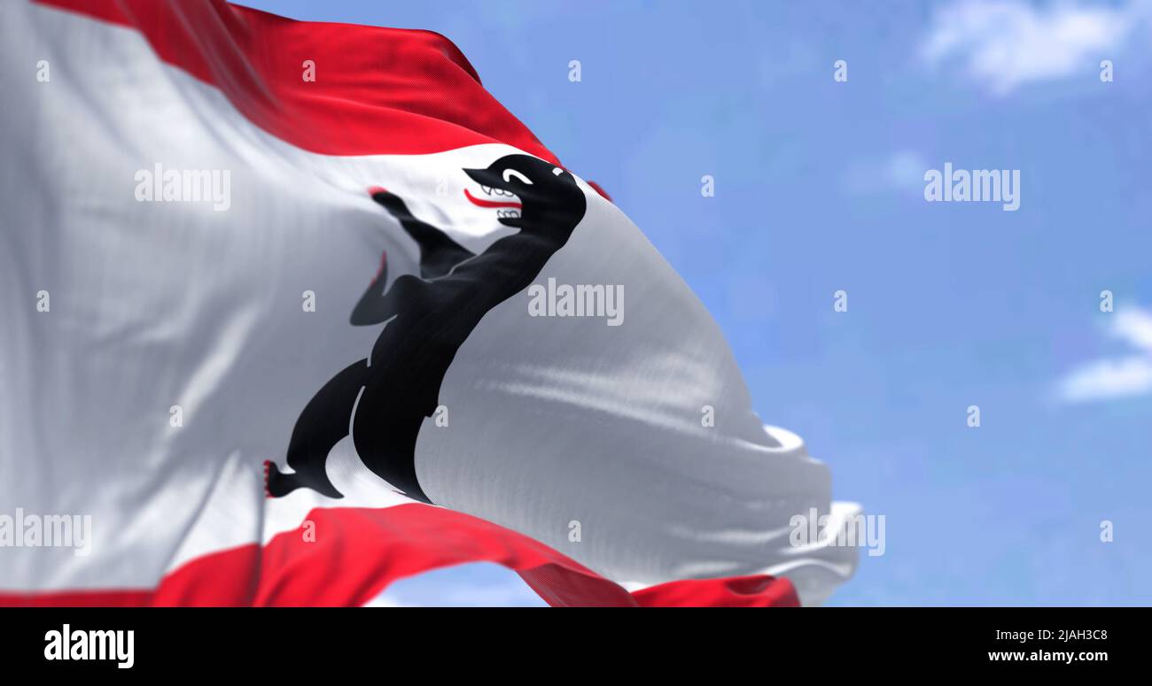 The civil flag of Berlin waving in the wind on a clear day. Berlin is ...