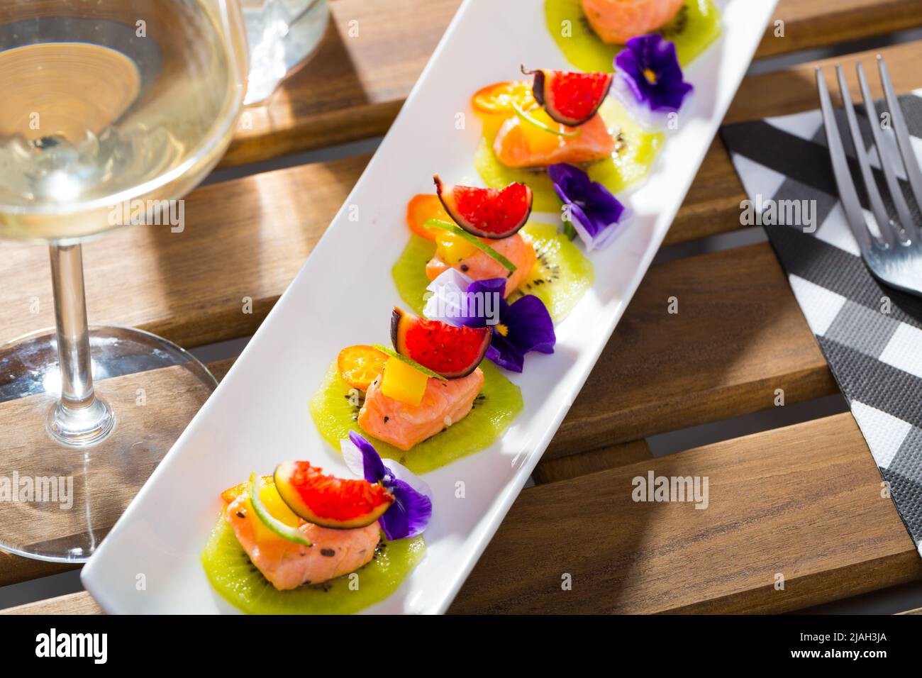 Delicious canapes with marinated salmon Stock Photo - Alamy