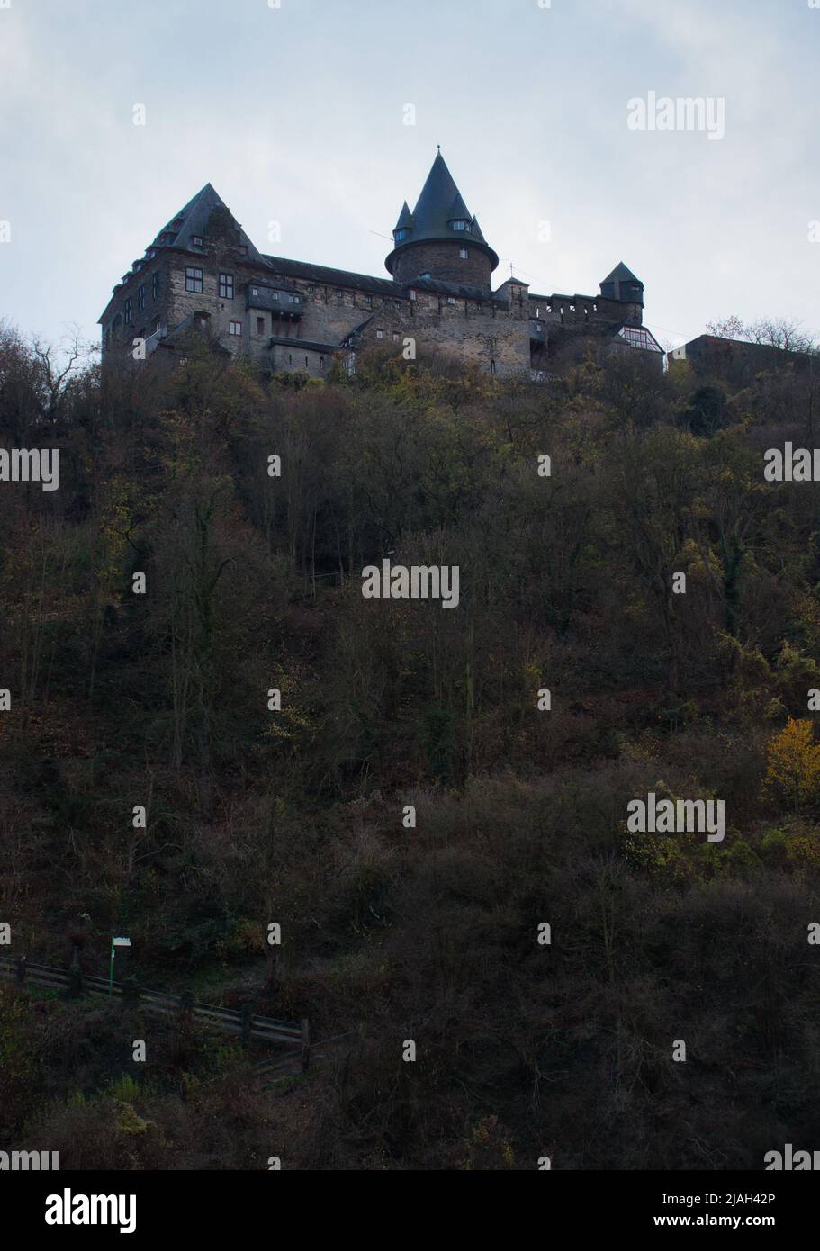 Burg Stahleck, a castle on a hill with trees on a fall day in Bacharach ...