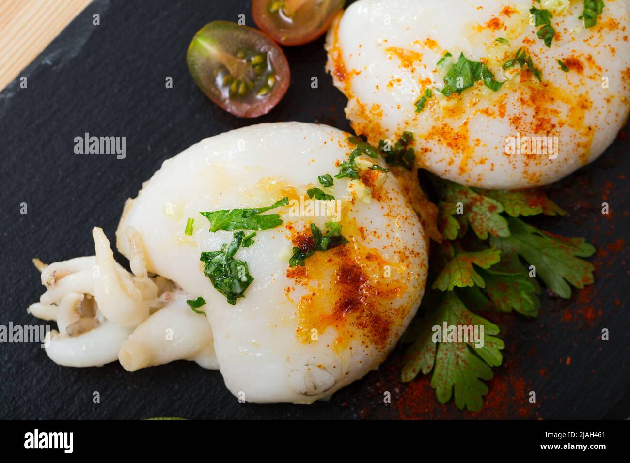 Roasted sepia served with shrimps Stock Photo - Alamy