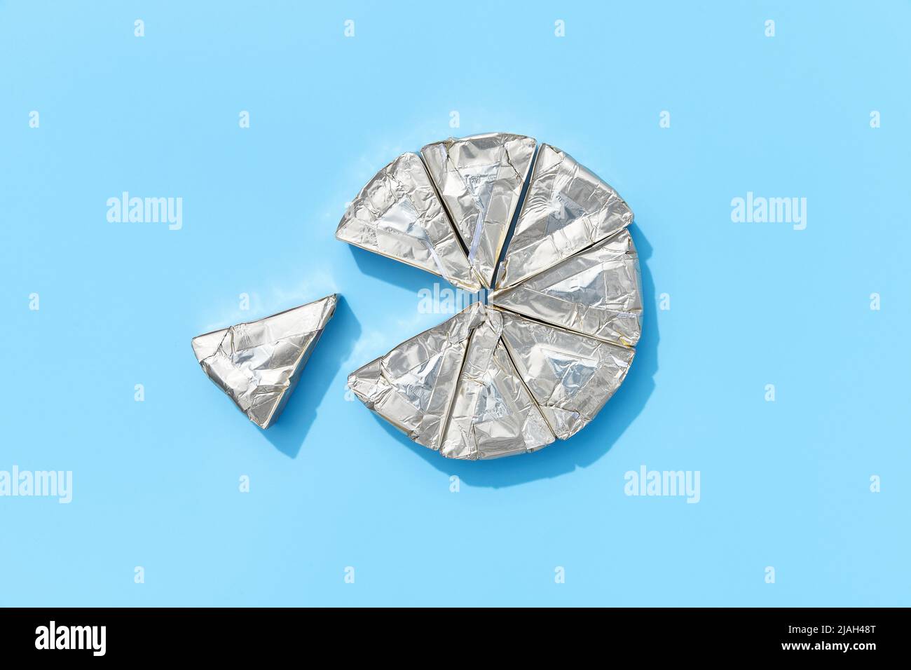 Processed cheese on blue background with deep long shadows. Minimal ...