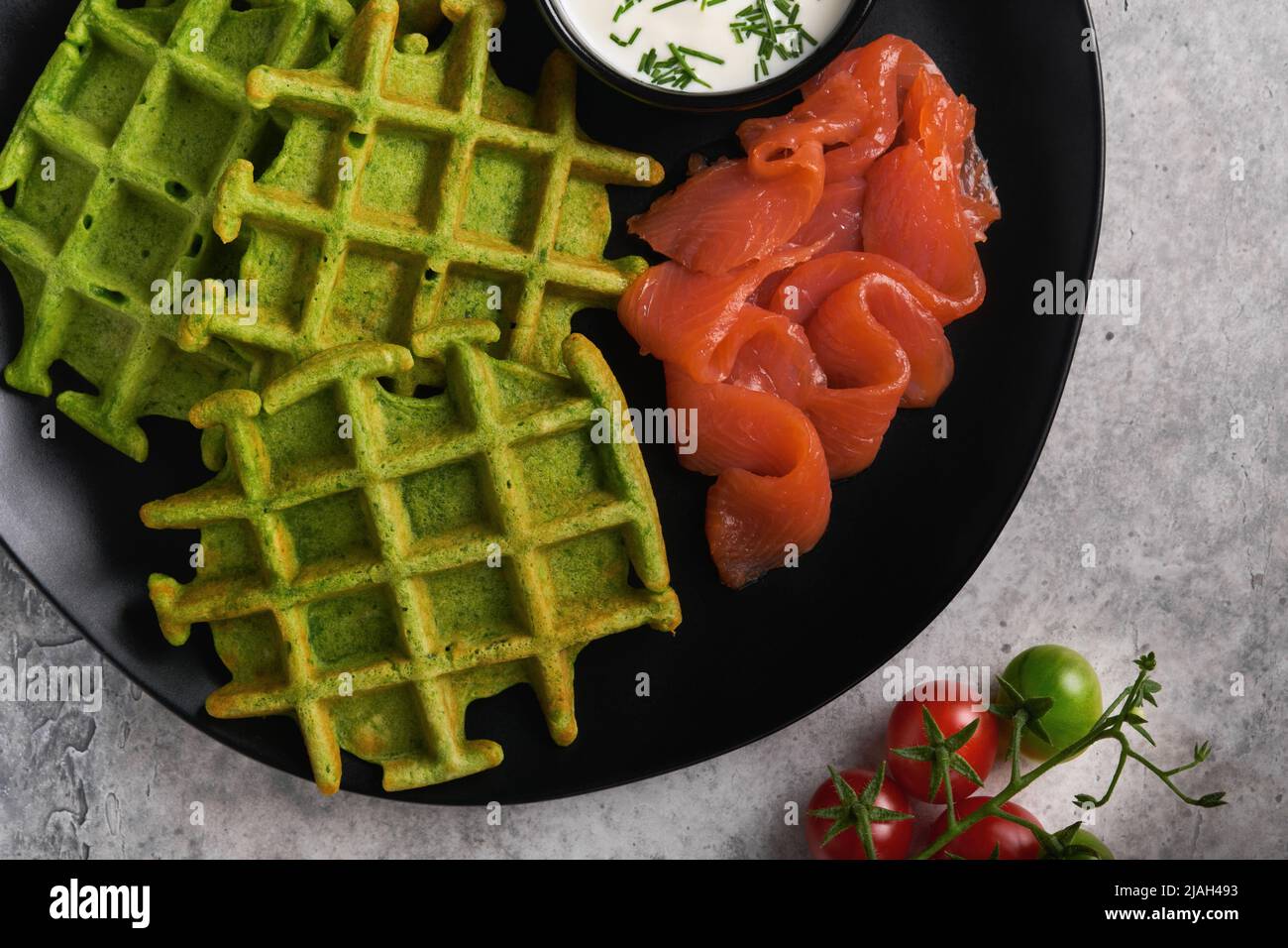 Green Belgian waffles. Spinach or wild garlic or pesto waffles with red ...