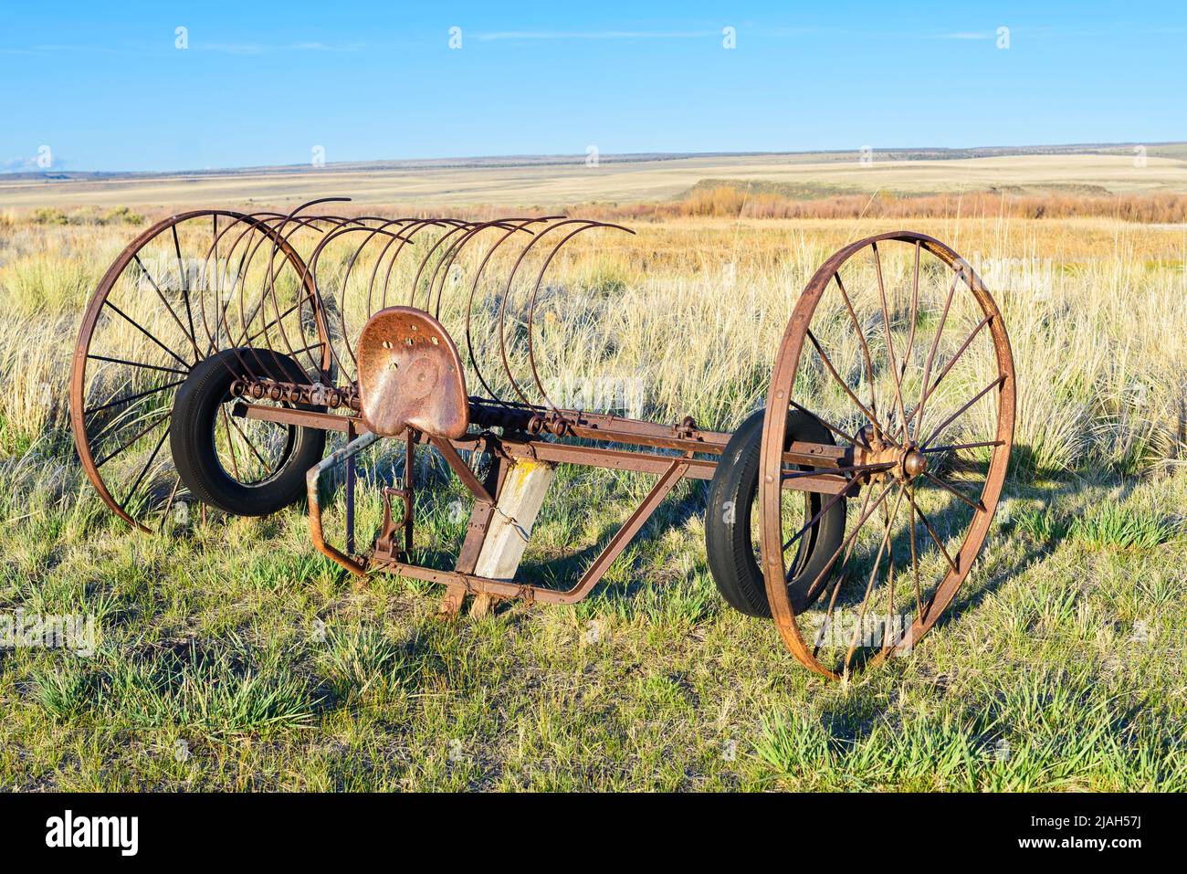 An antique spring harrow in a field at Malheur National Wildlife Refuge ...