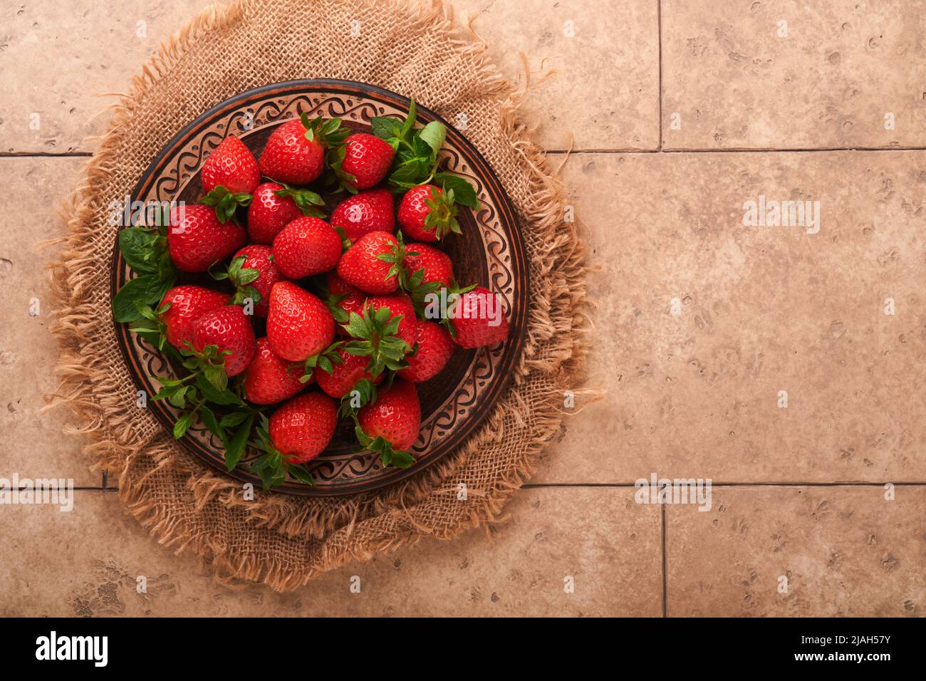 Strawberry berry. Fresh red strawberry in ceramic rustic plate on an ...