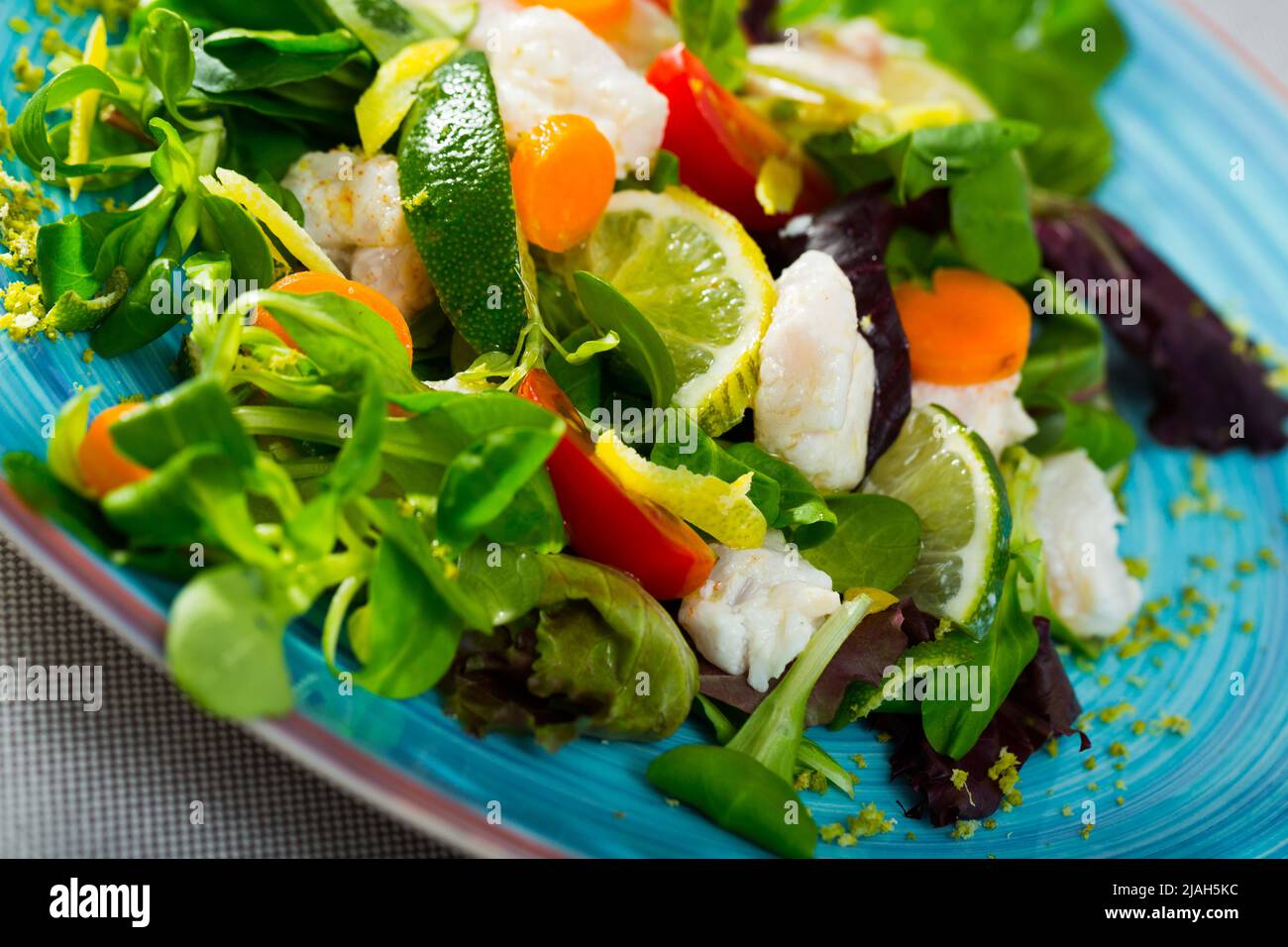 Salad with pickled merluccius Stock Photo - Alamy
