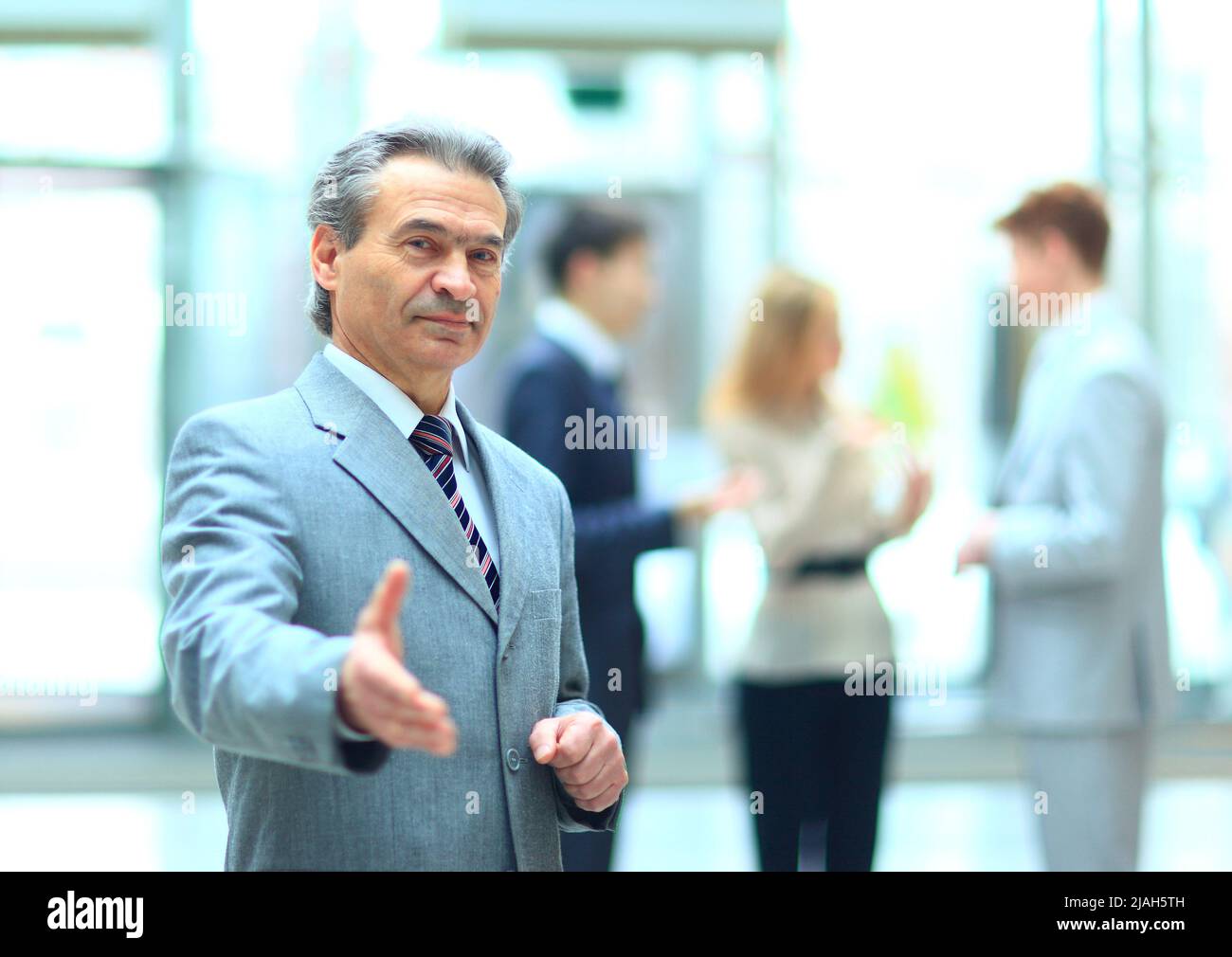 Welcoming business man ready to handshake with hand extended Stock ...