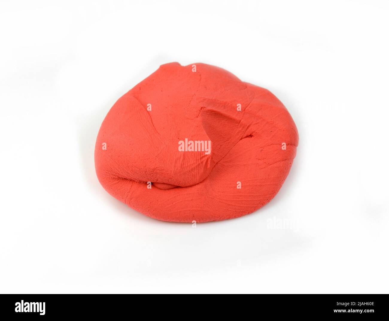Red Plasticine ball isolated on the white background Stock Photo - Alamy