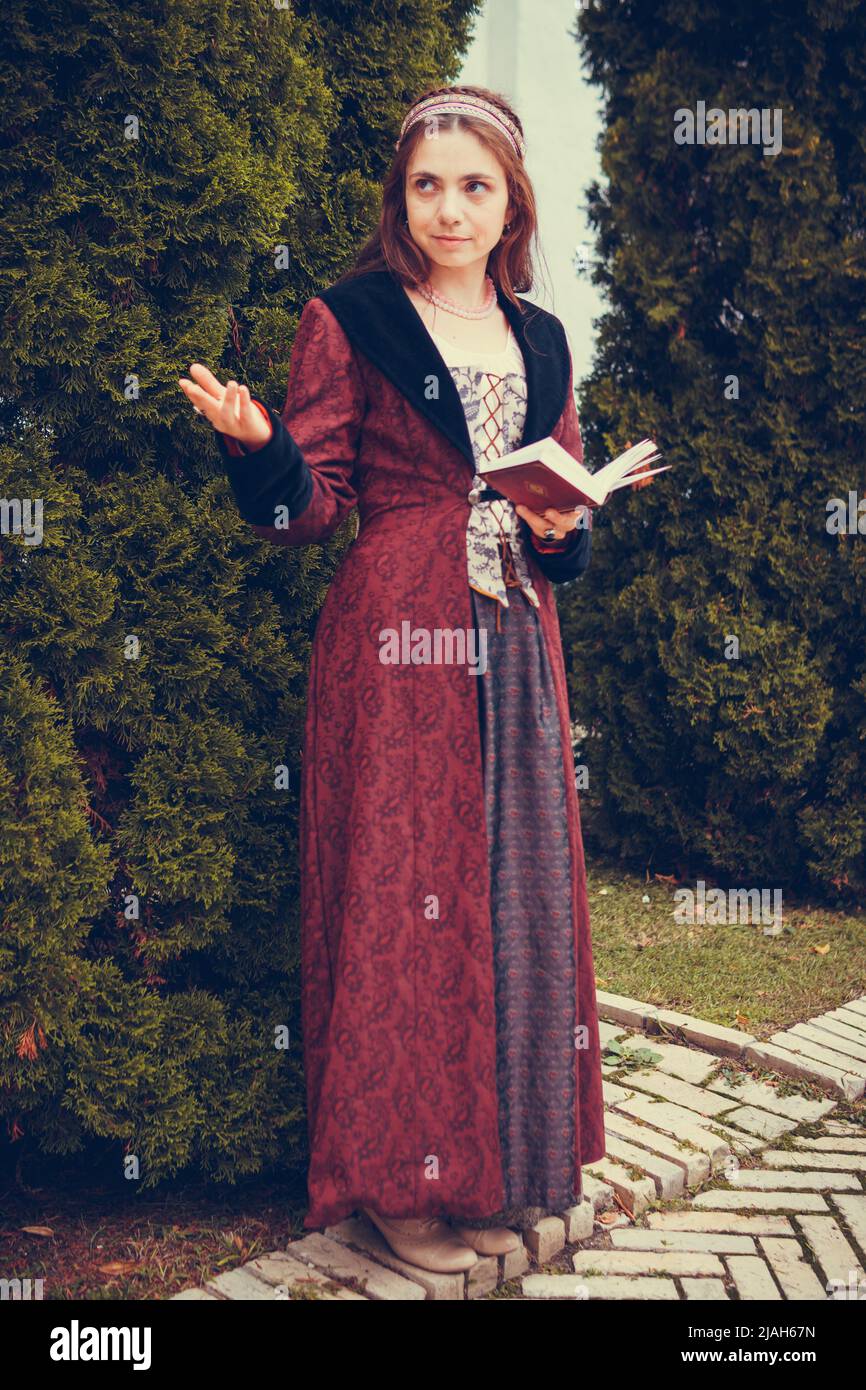 Portrait of brunette woman dressed in historical Baroque clothes ...