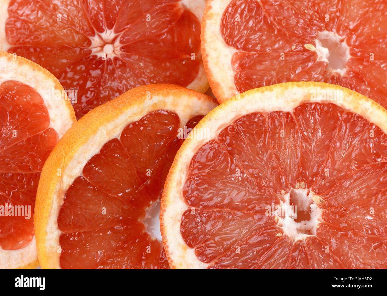 Top view of grapefruit slice, as background. Macro of red grapefruit. fruit citrus grapefruit ...