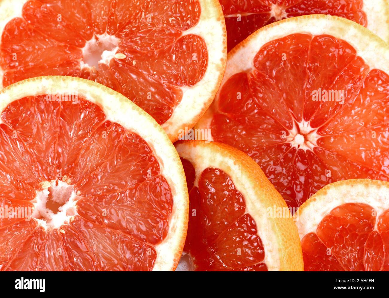Top view of grapefruit slice, as background. Macro of red grapefruit. fruit citrus grapefruit ...