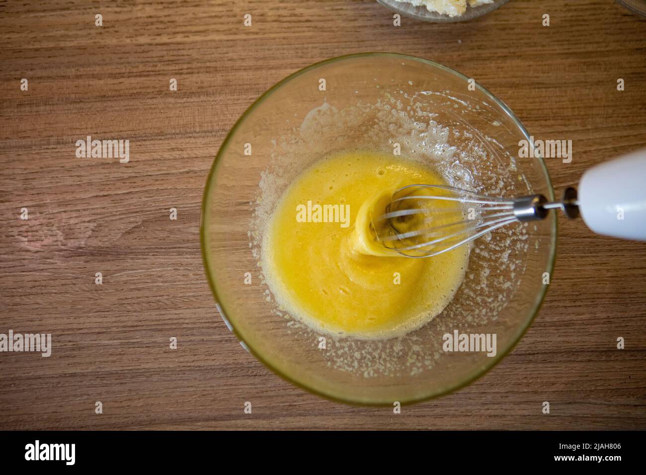 mixing eggs in bowl close up cooking concept Stock Photo - Alamy