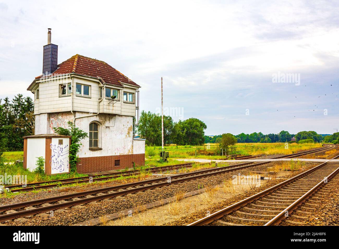 Green and peaceful farming landscapes train station building and ...