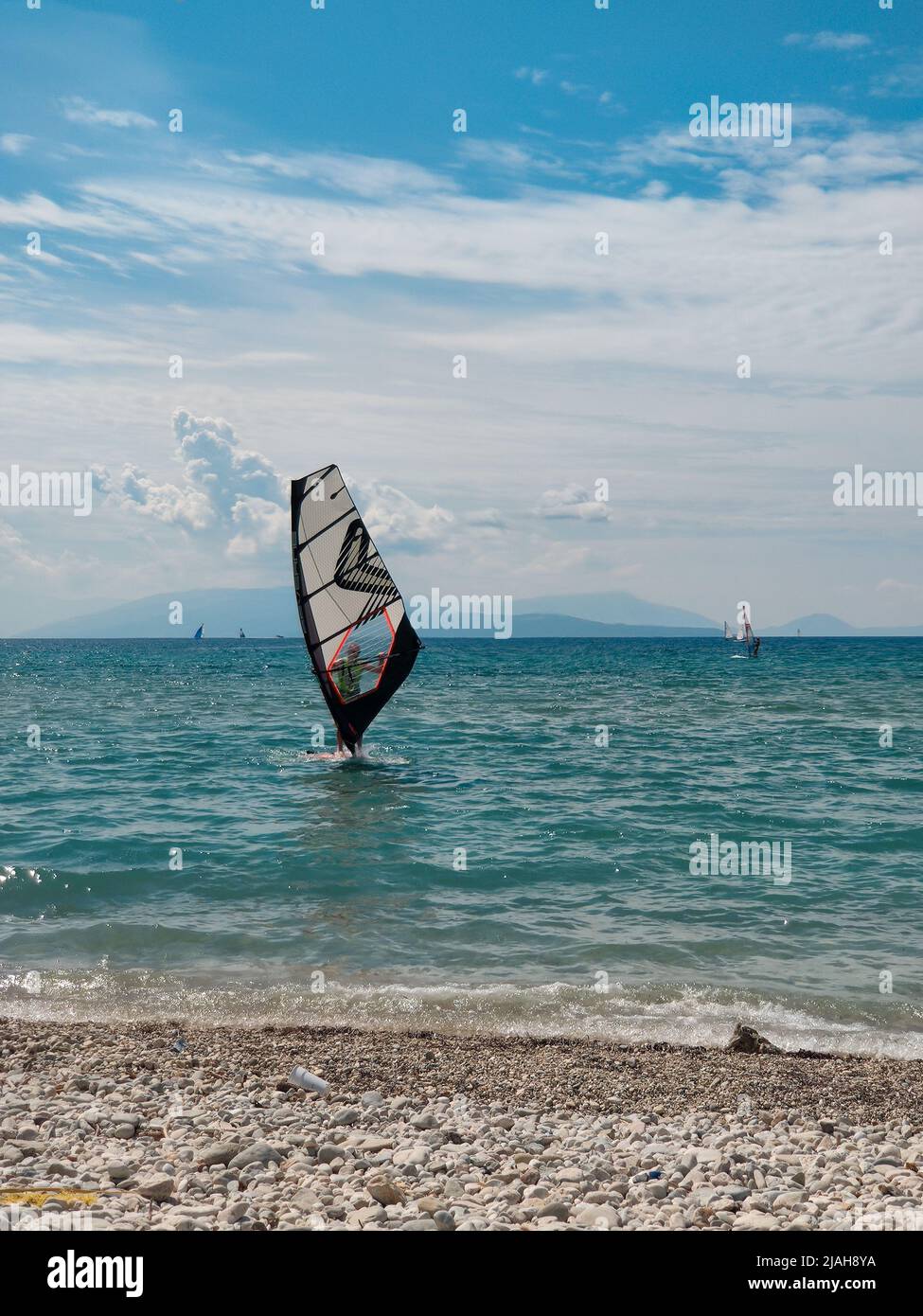 wind surfing at vasiliki beach Lefkada island Greece copy space Stock ...