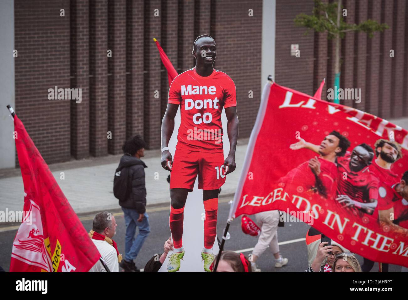 Supporters hold up a cardboard cut out of Sadio Mane asking him not to ...