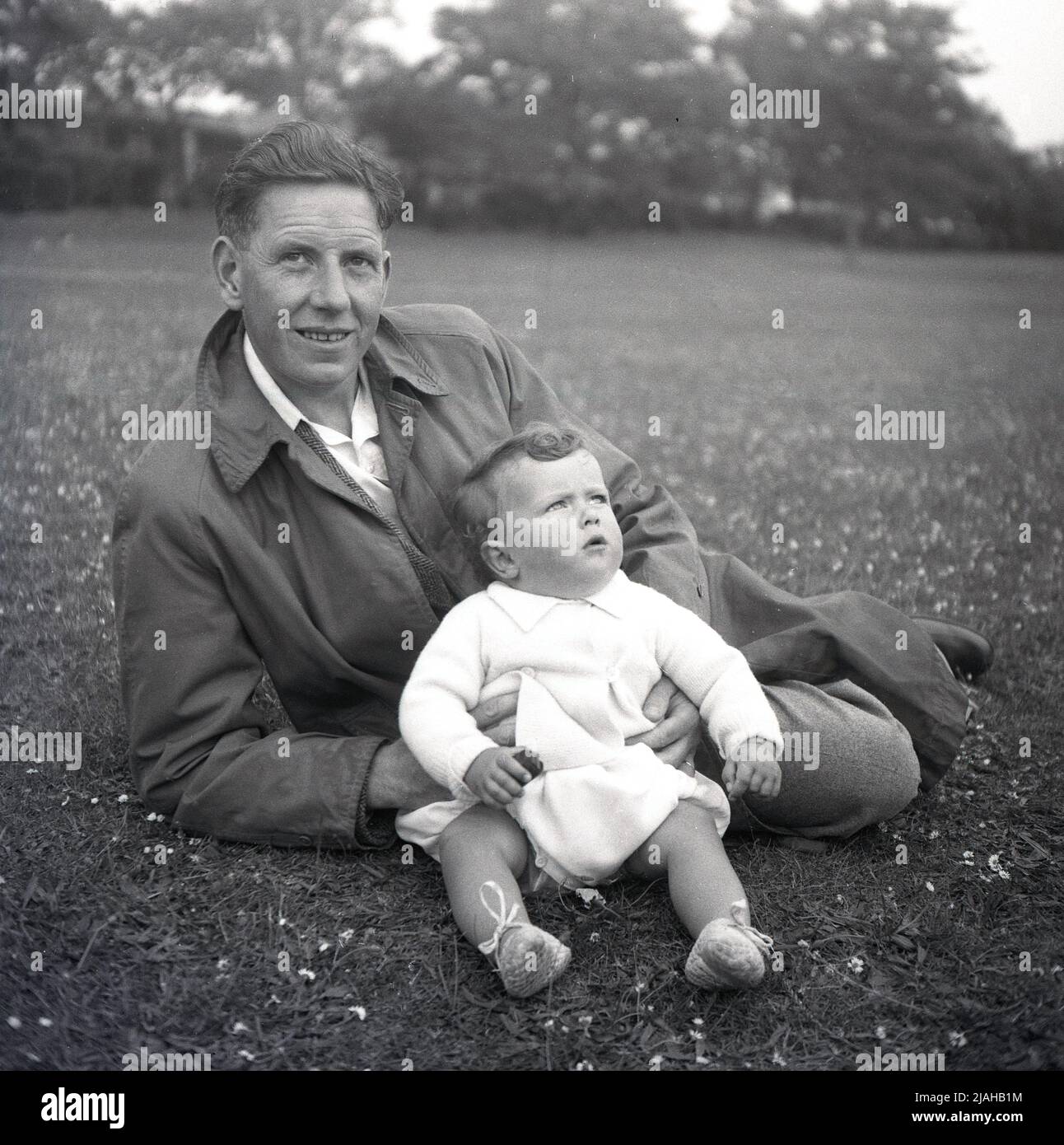 Man and boy in park in 1950s hi-res stock photography and images - Alamy