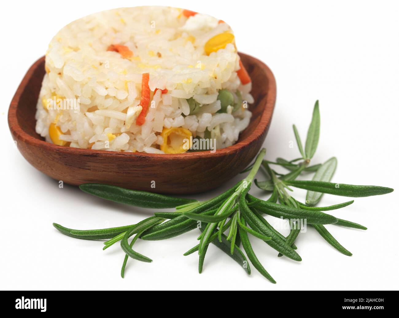 Fried rice with rosemary over white background Stock Photo - Alamy