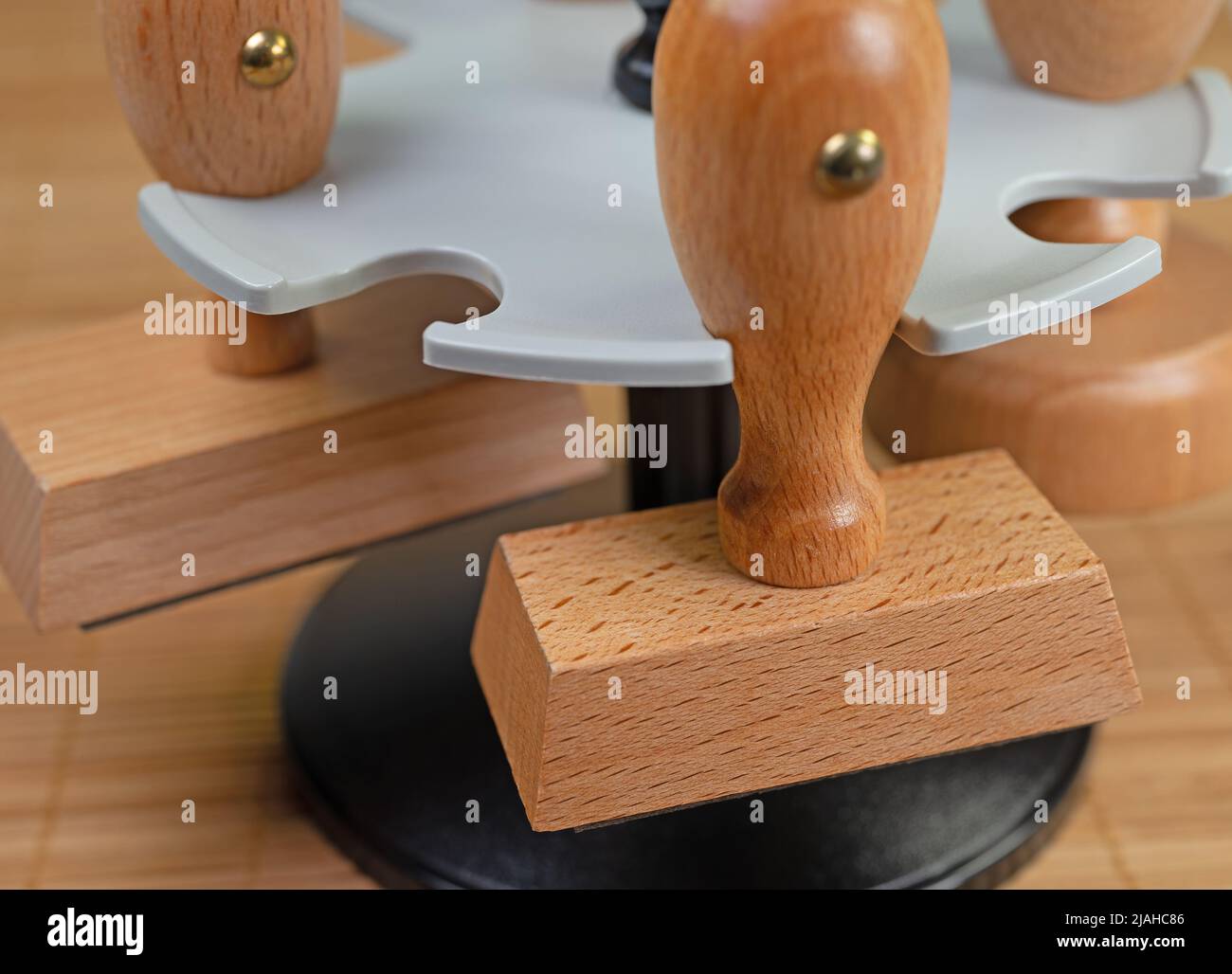 Various wooden stamps in stamp holders Stock Photo - Alamy