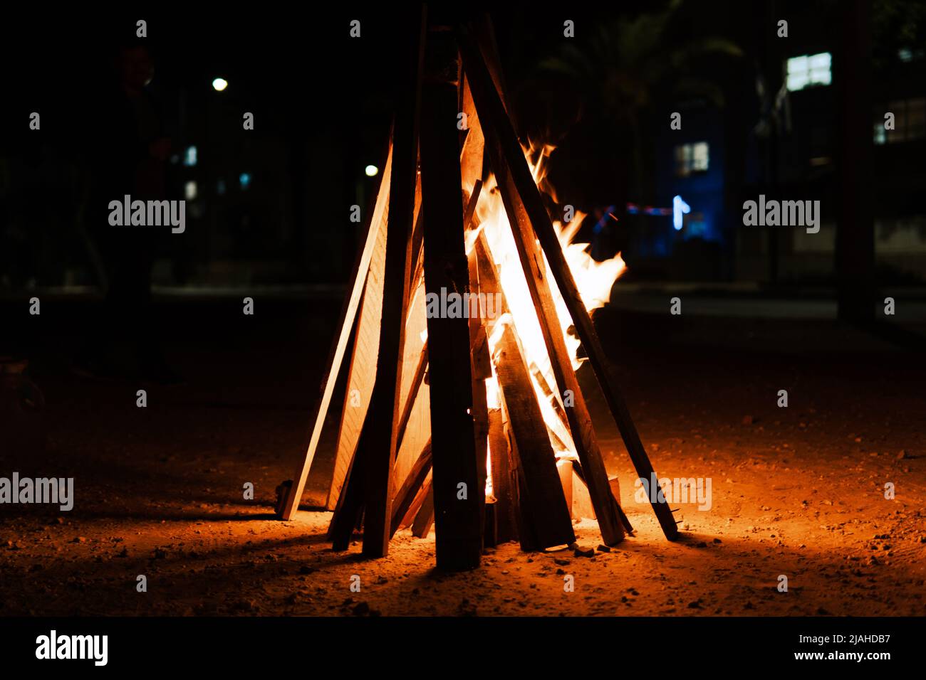 A campfire with sparks at night dark. Orange flame outdoor Stock Photo ...