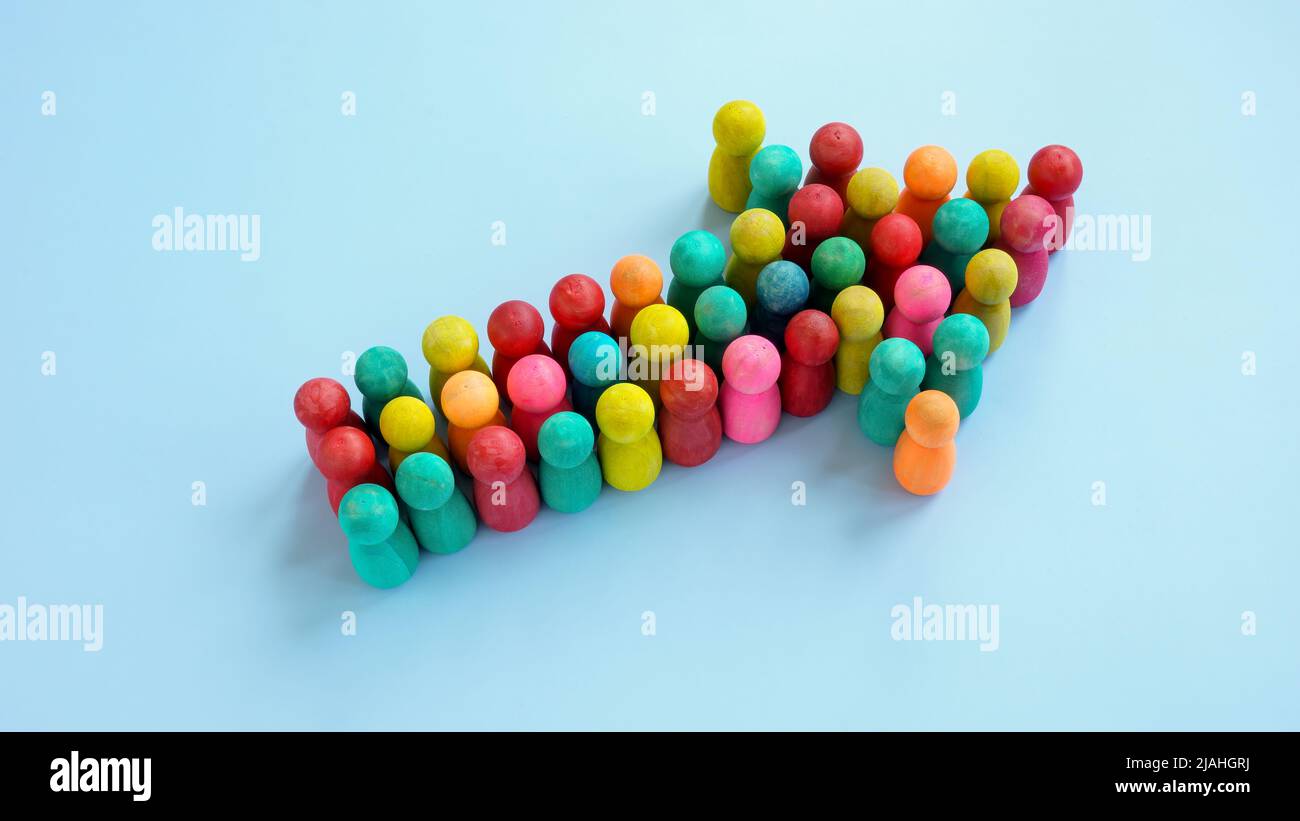 Unity concept. An Arrow from multi-colored figures Stock Photo - Alamy