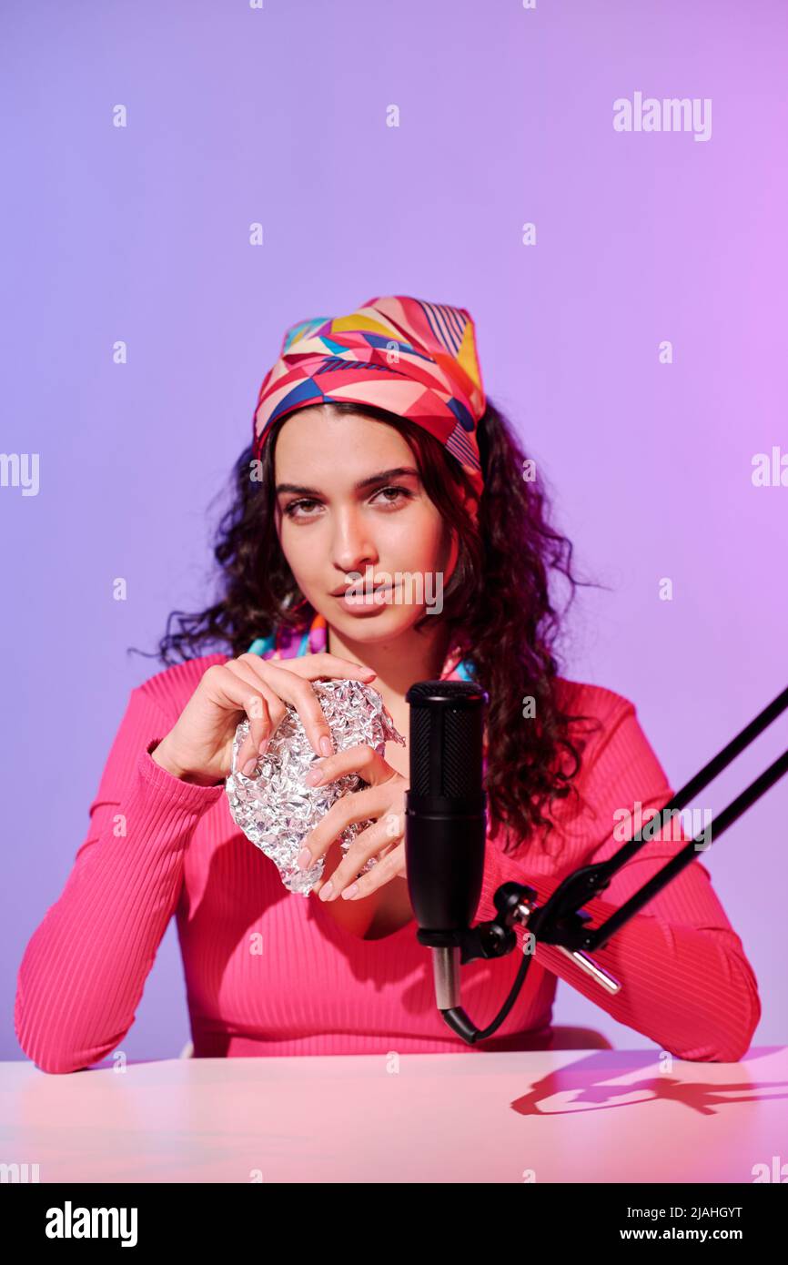 Vertical shot of stylish young woman creating content for ASMR blog ...