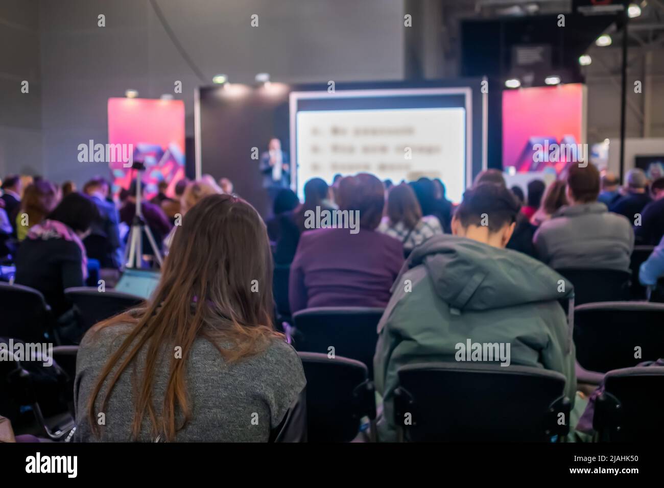 Back view of people listening presentation at conference hall Stock ...