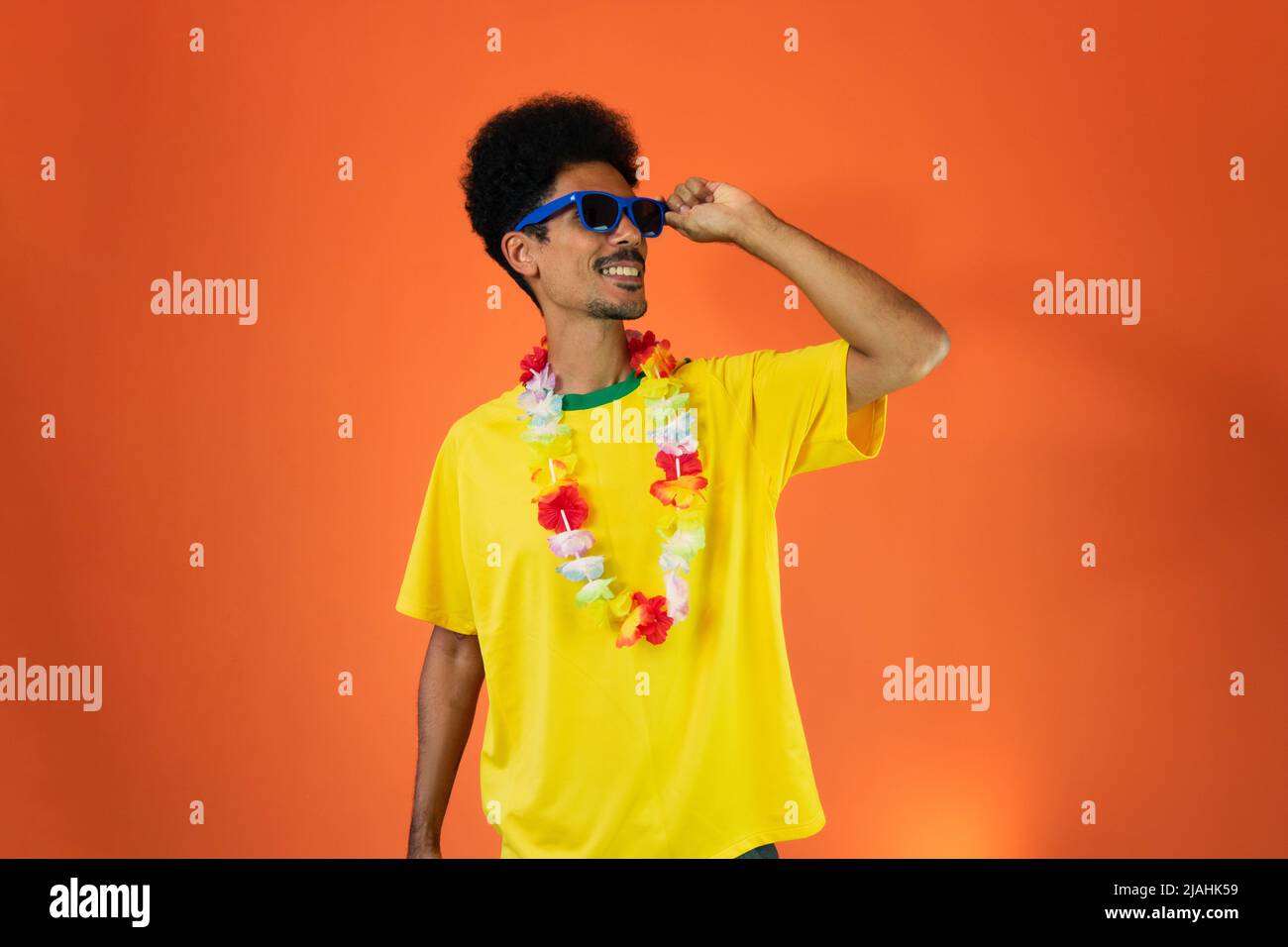 Soccer Brazilian Fan Celebrating Isolated on Orange Background. Excited ...