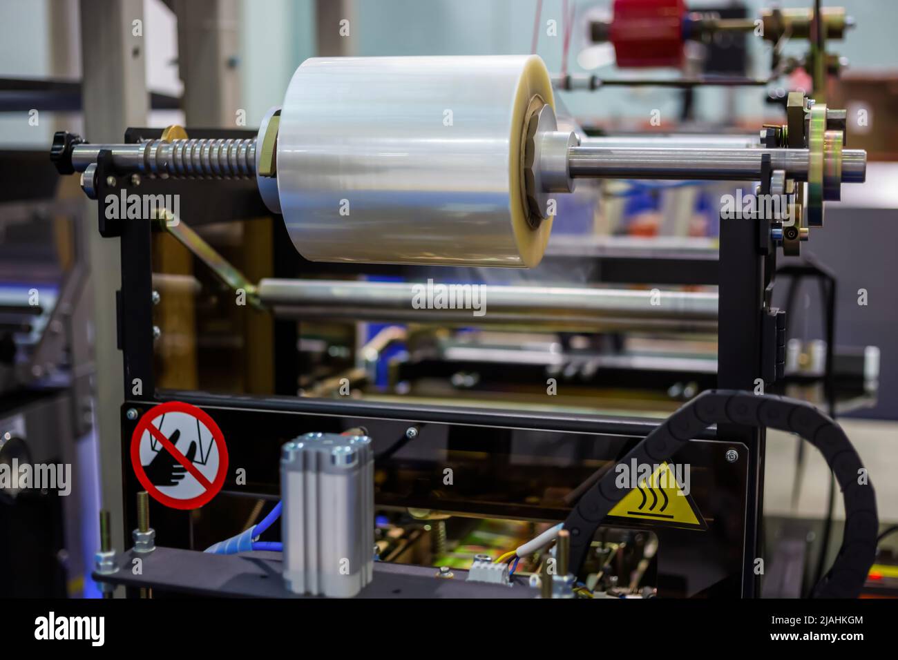 Part of automatic packaging machine - roller with polyethylene film ...