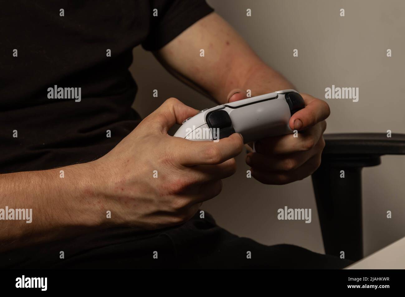 A University Aged Male Student playing a video game Stock Photo - Alamy