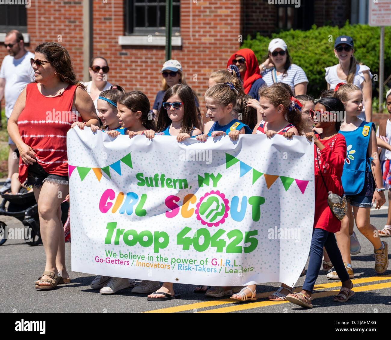 Suffern, NY - USA - May 30, 2022 Girl Scouts from Troop 40425 march the ...