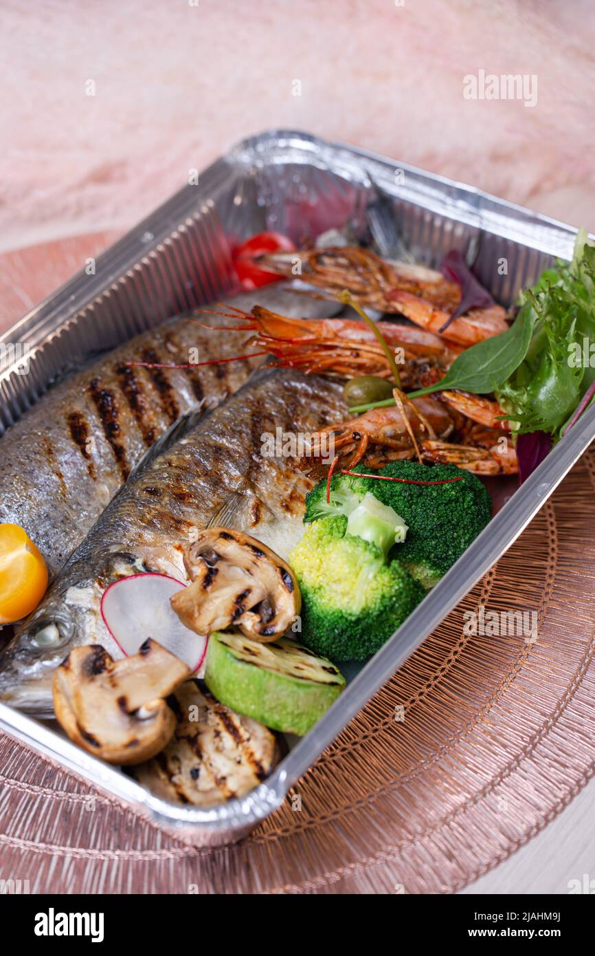 delicious assorted grilled fish dishes top view Stock Photo - Alamy
