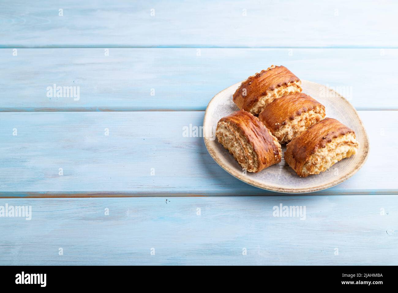 Traditional armenian dessert gata on a blue wooden background. side ...