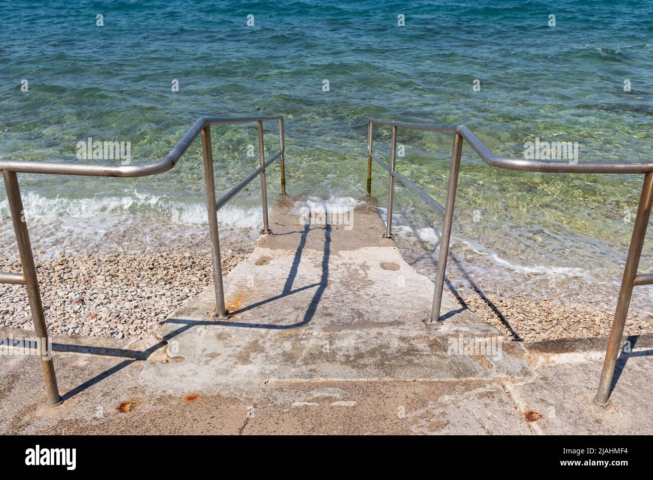 Accessible beach with ramp for people with disability using wheelchair ...