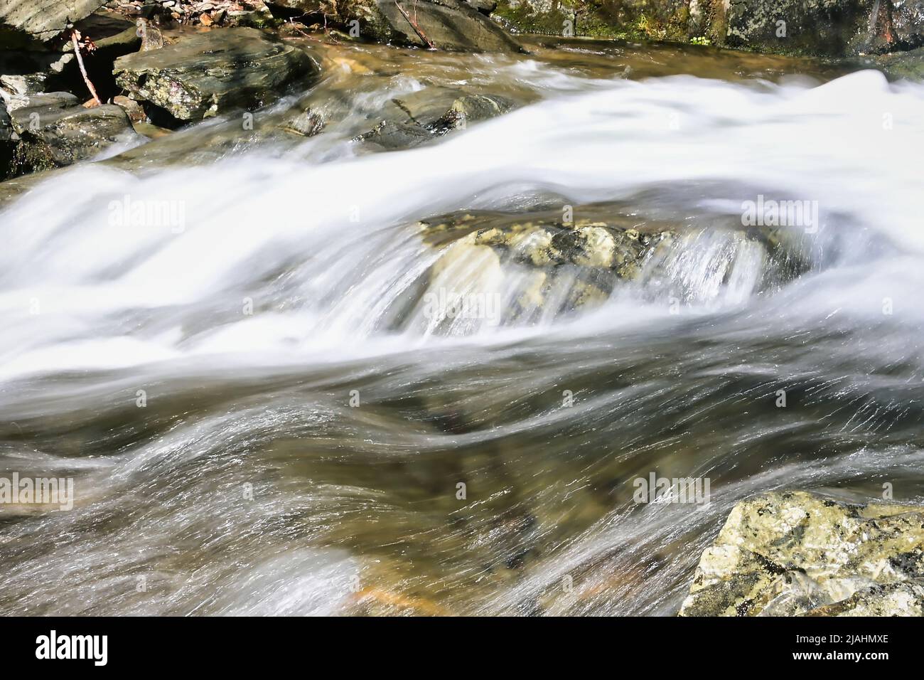 water flowing over rocks Stock Photo - Alamy