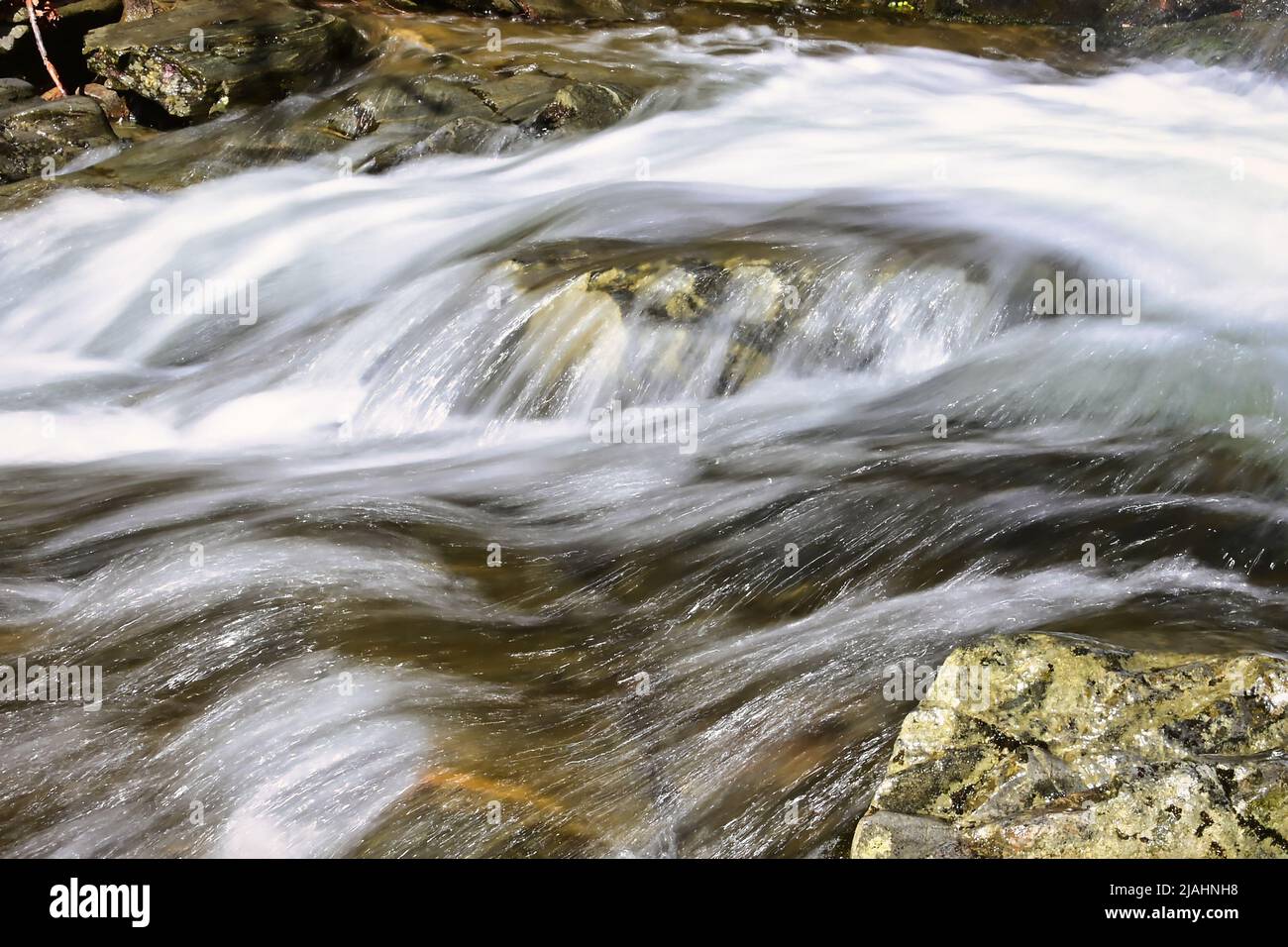 water flowing over rocks Stock Photo - Alamy