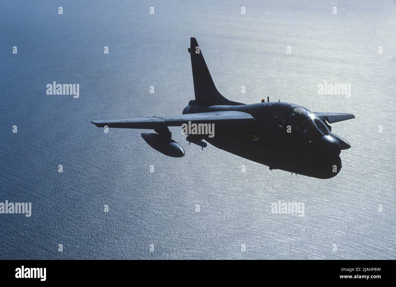 LTV TA7 Corsair II in silhouette over the Pacific ocean Stock Photo - Alamy