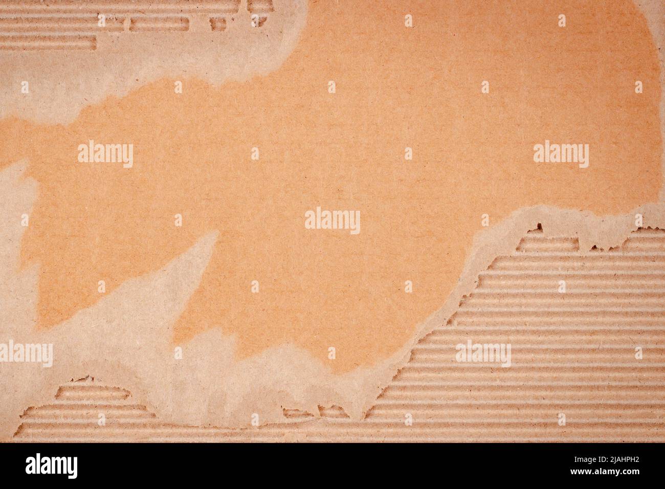 Brown corrugated cardboard with torn edges. Cardboard packaging mesh ...