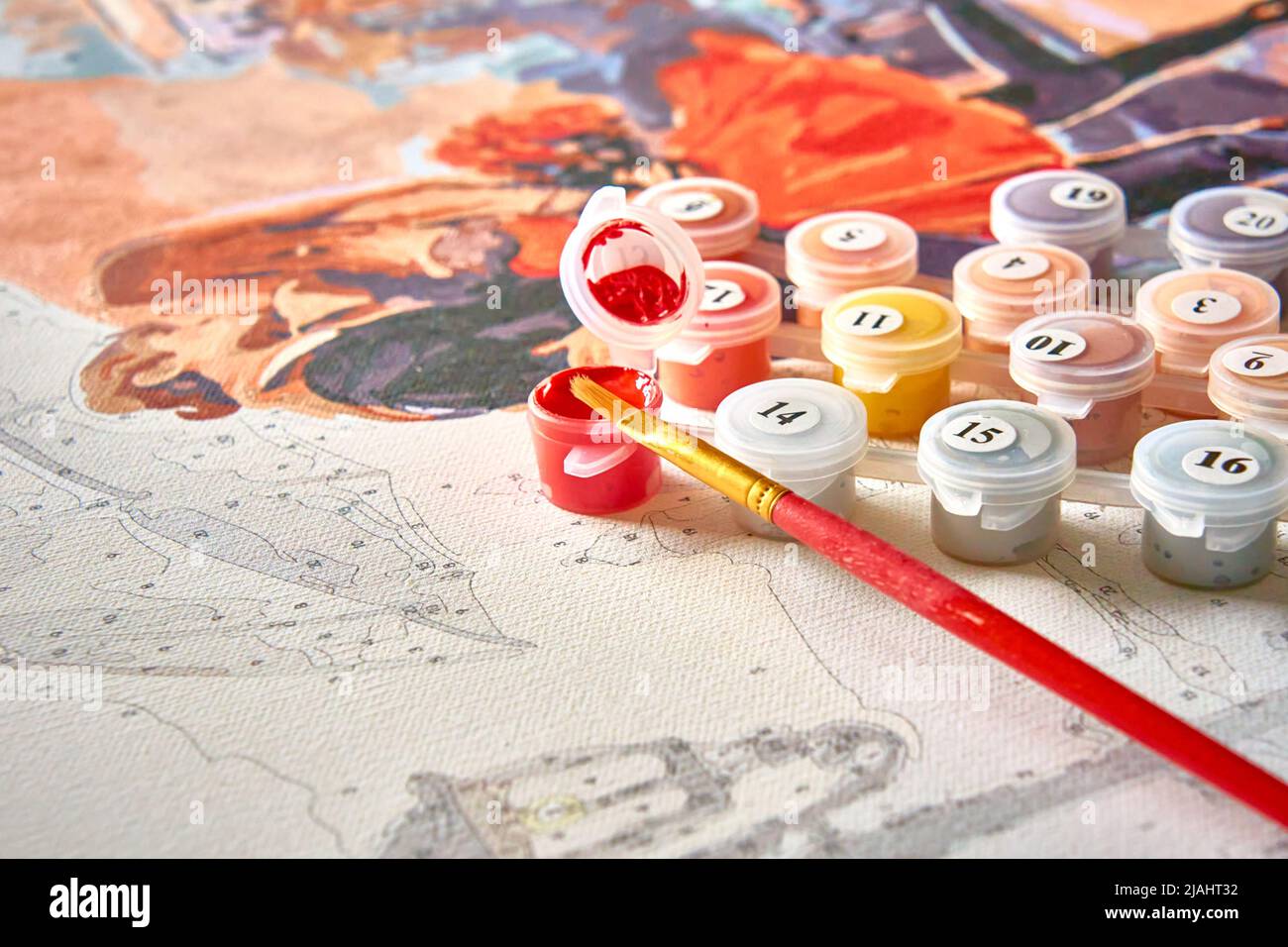 Painting for beginners. A set of numbered acrylic paints, a brush and a ...