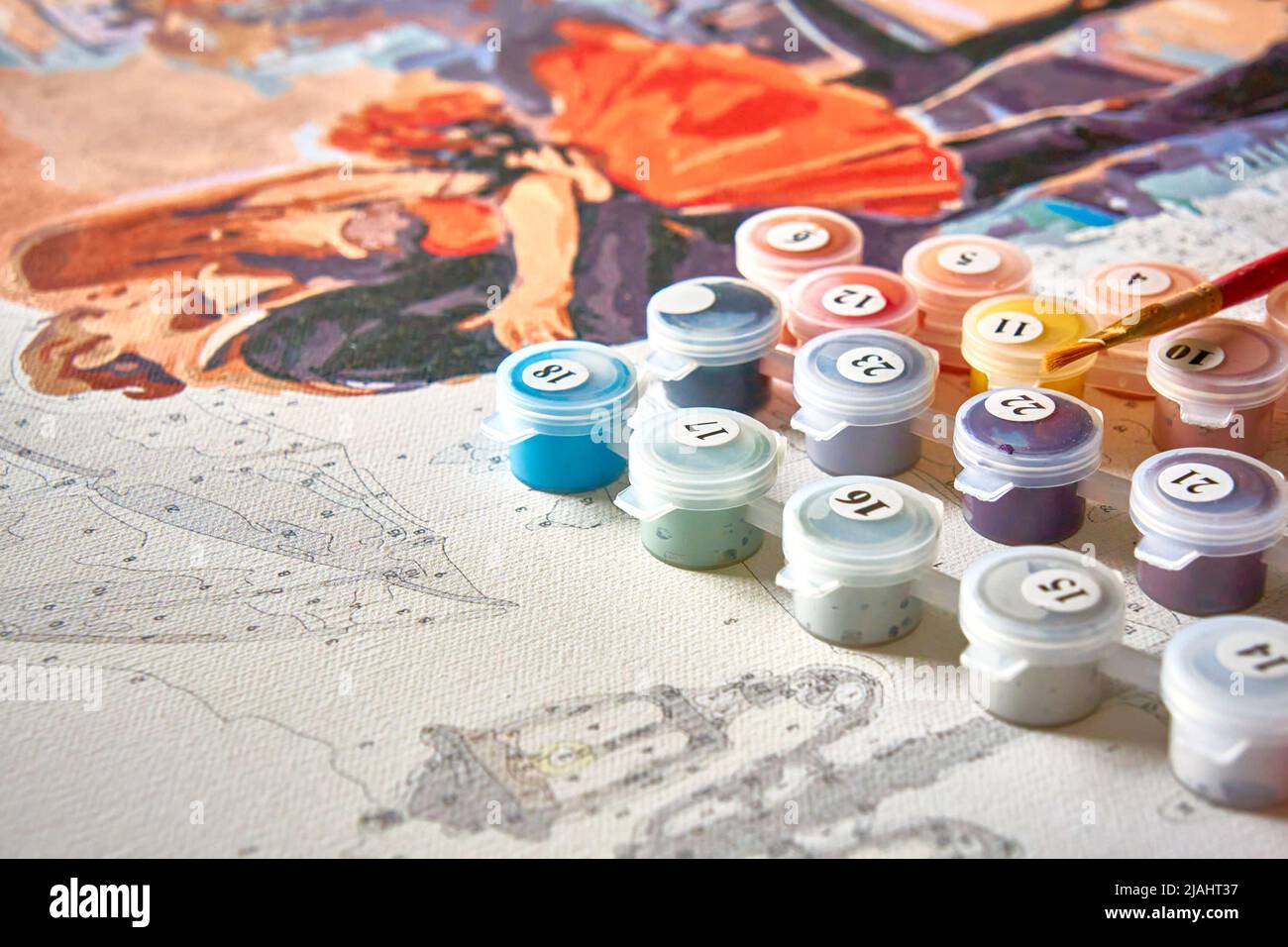 Painting for beginners. A set of numbered acrylic paints, a brush and a ...