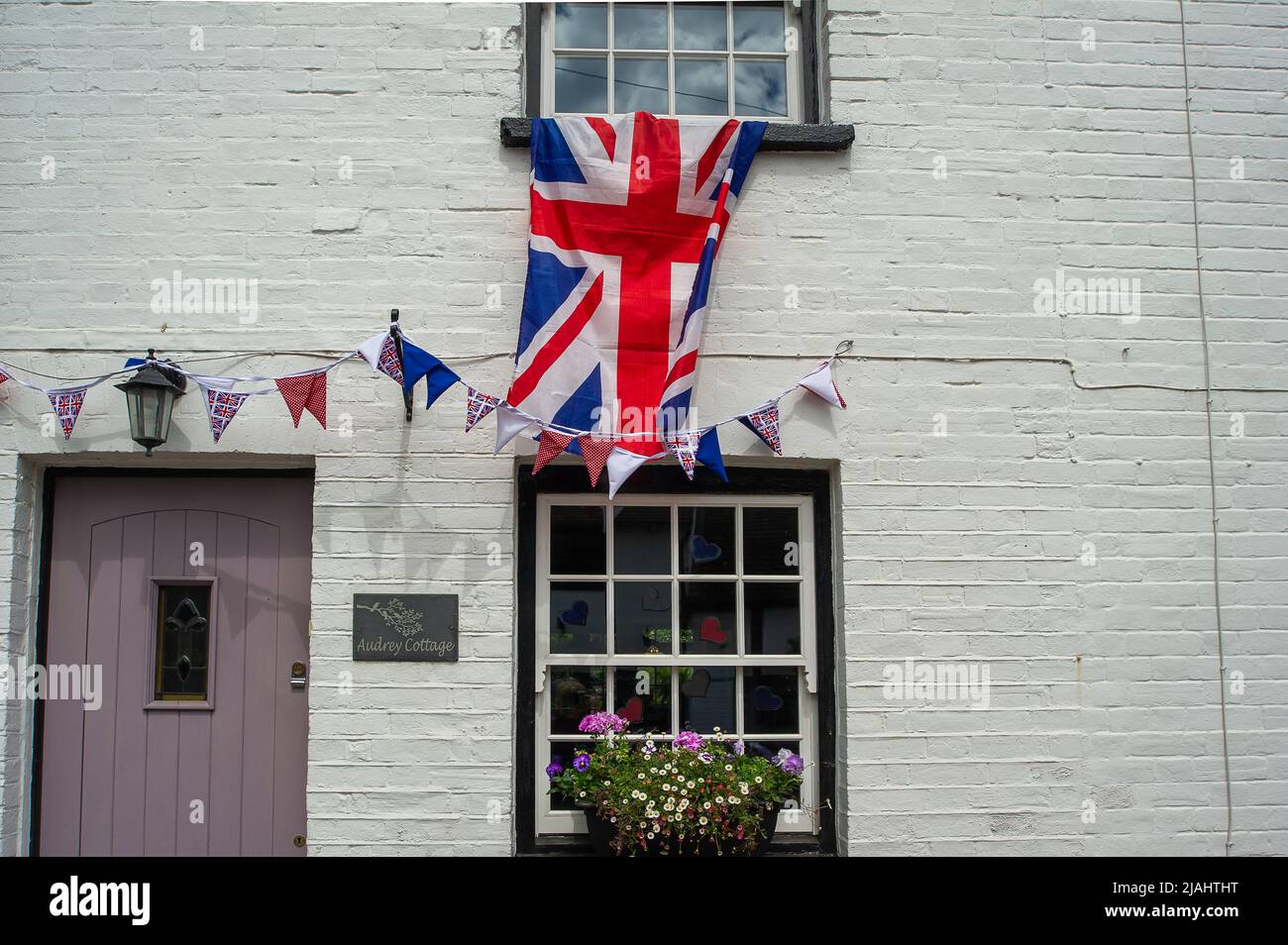 Cookham, Berkshire, UK. 30th May, 2022. The wind blows a Union Jack ...