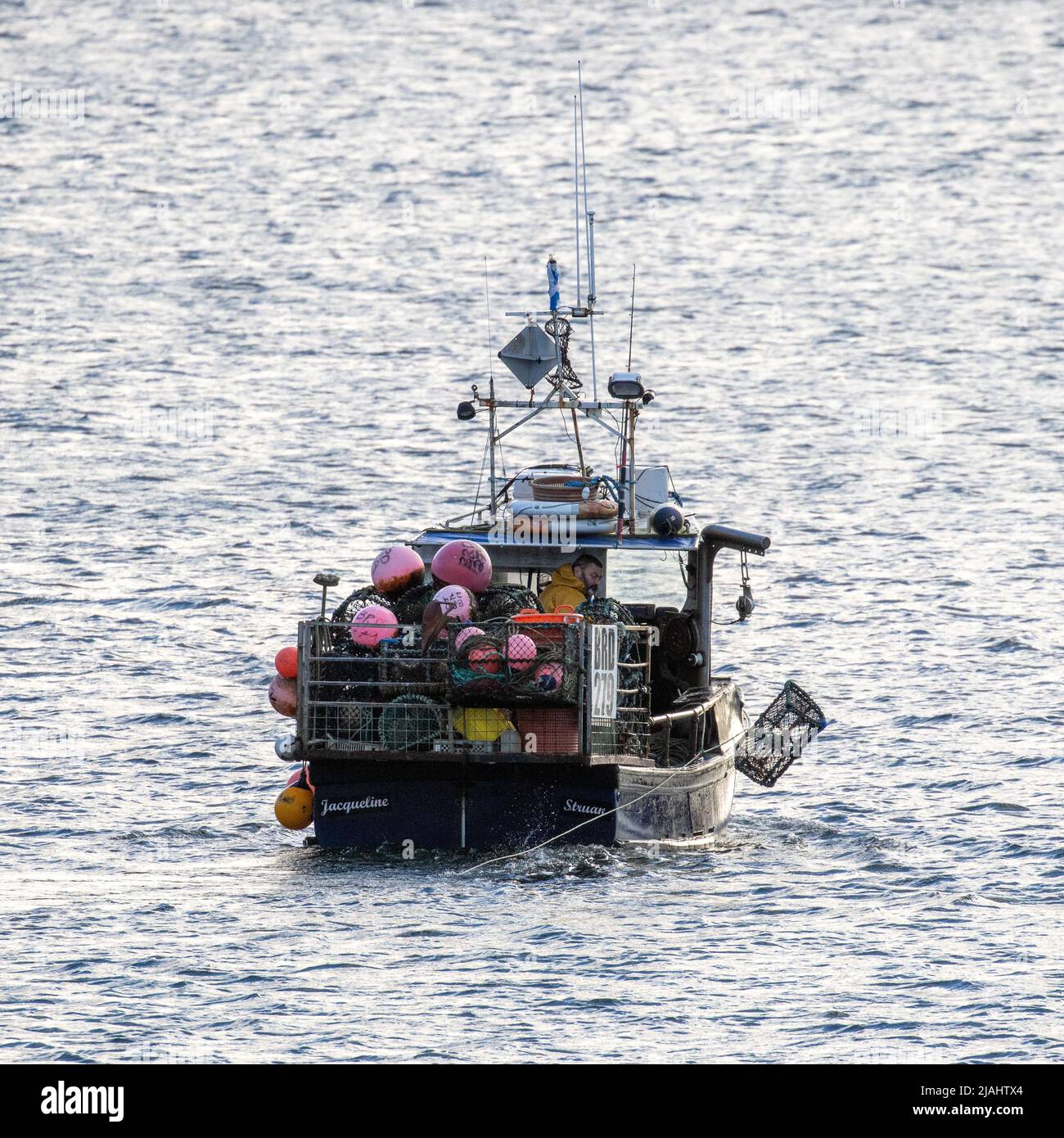 Setting a lobster pot hi-res stock photography and images - Alamy