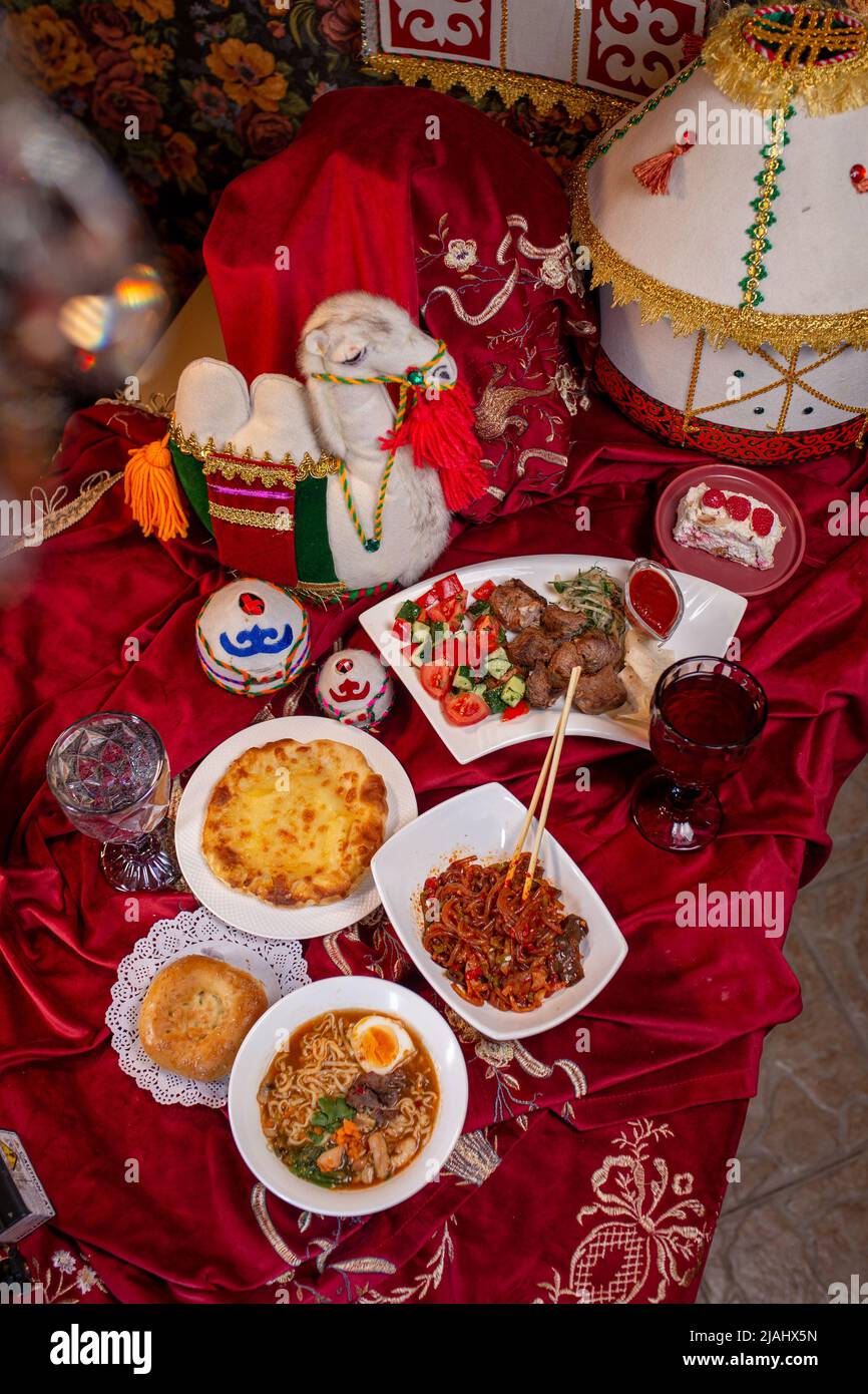 Kazakh table-dastarkhan with different dishes. national Kazakh festive ...