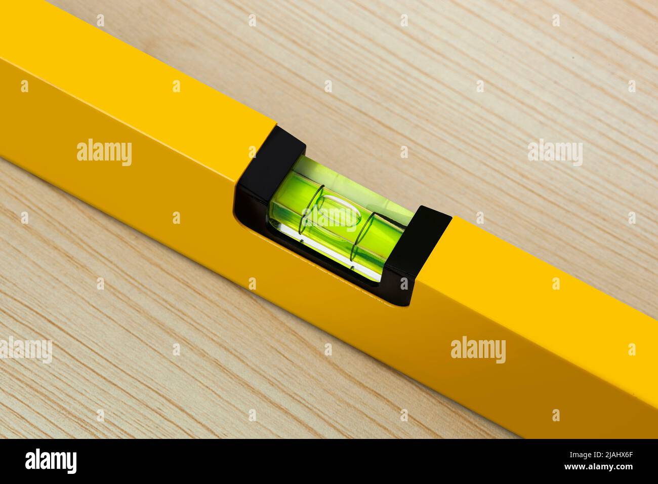 Yellow building level, isolated on a white background Stock Photo - Alamy