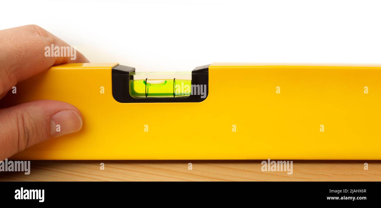 Yellow building level, isolated on a white background Stock Photo - Alamy