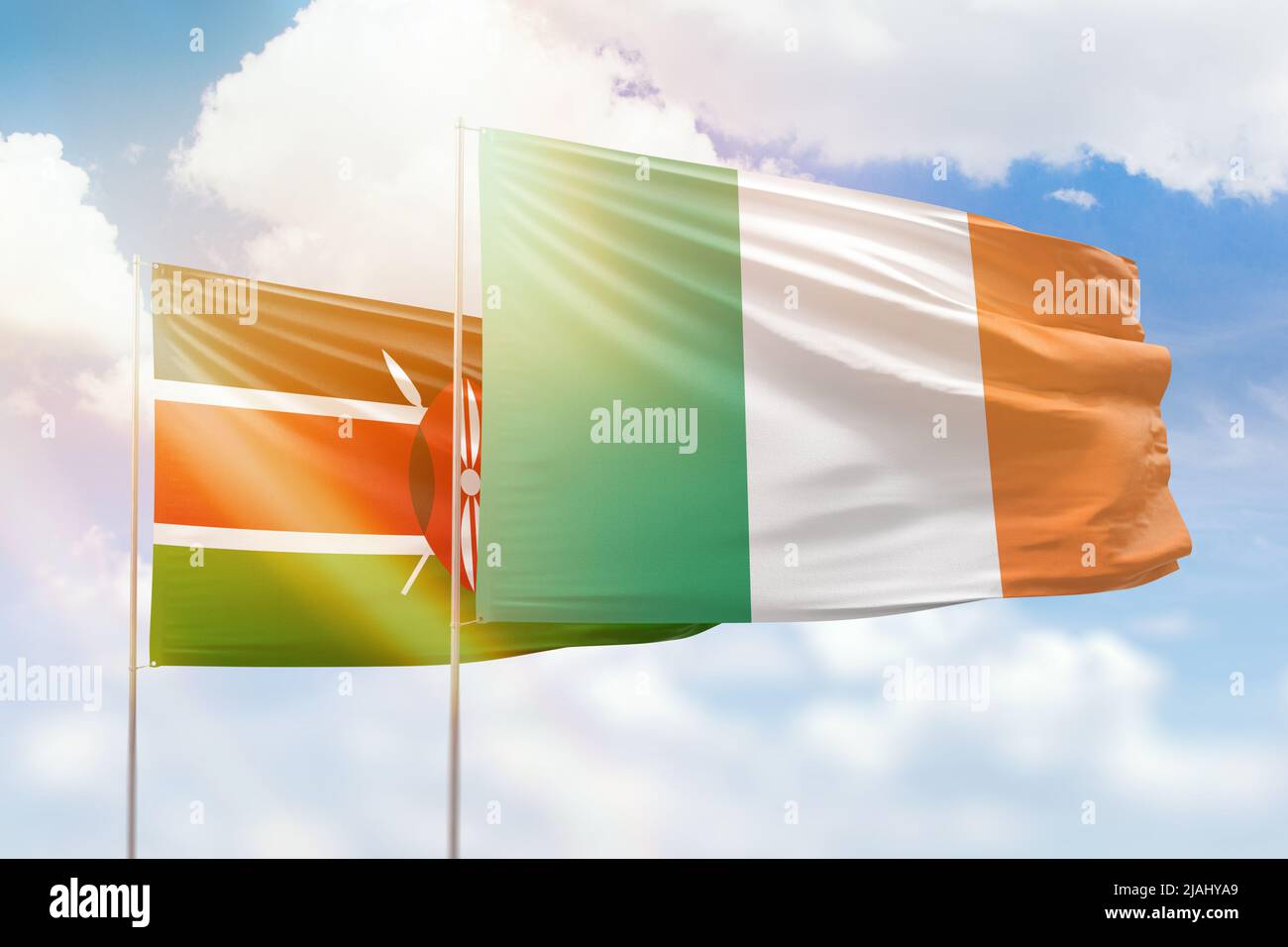 Sunny blue sky and flags of ireland and kenya Stock Photo - Alamy