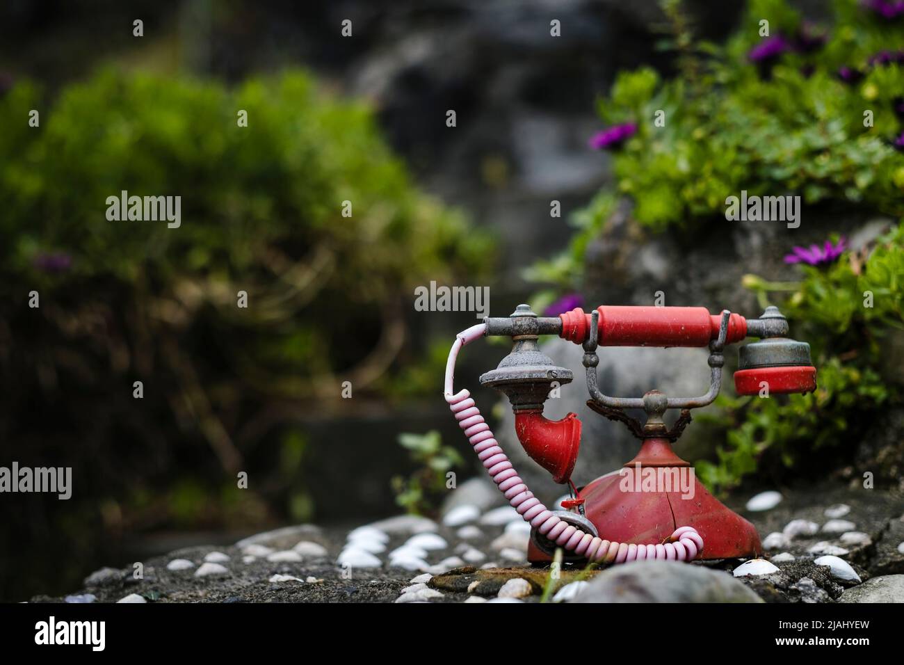 Antique telephone, standing outdoors in the garden Stock Photo - Alamy