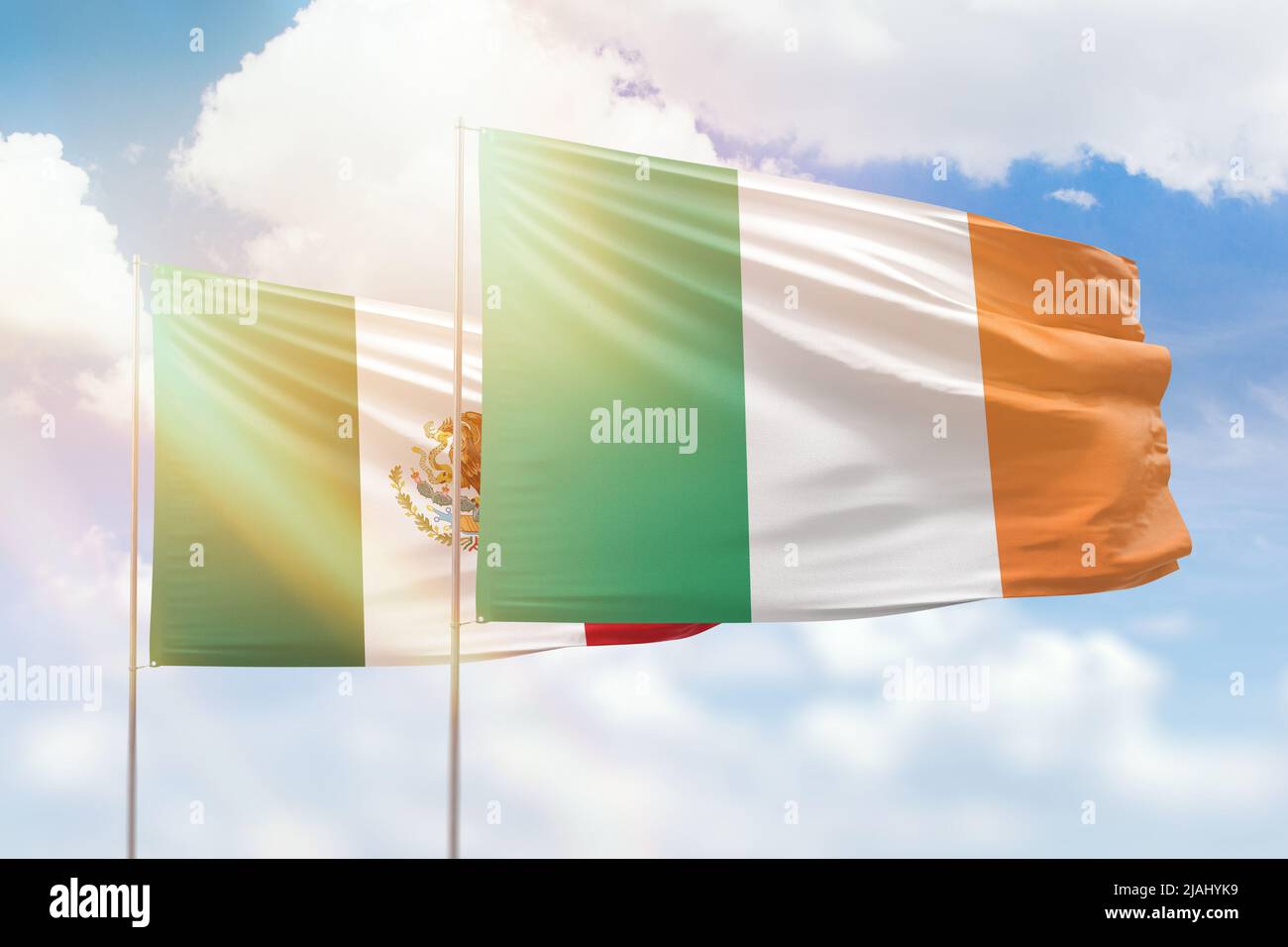 Sunny blue sky and flags of ireland and mexico Stock Photo - Alamy
