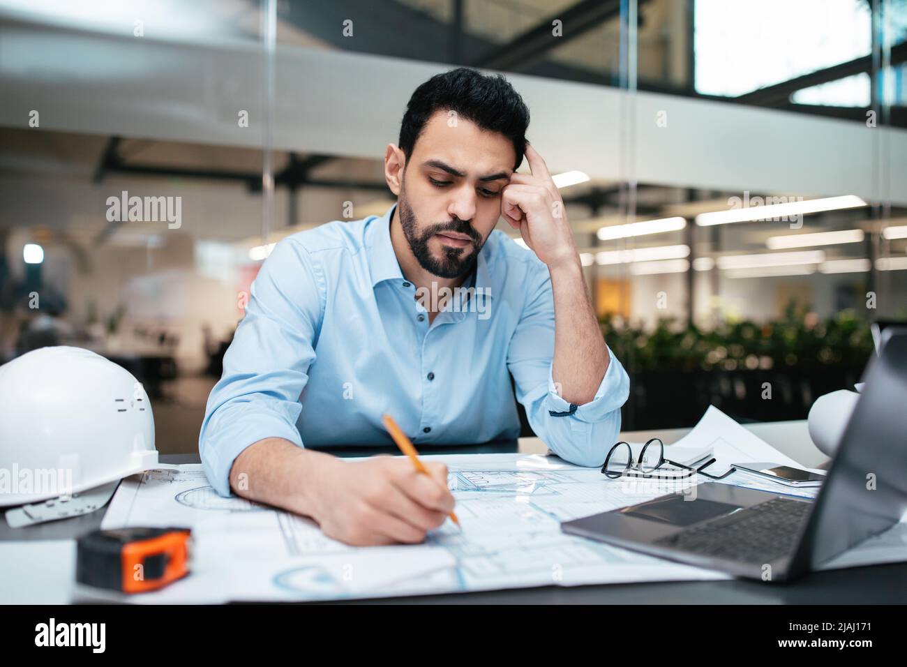 Sad serious pensive attractive millennial arab man engineer with beard ...
