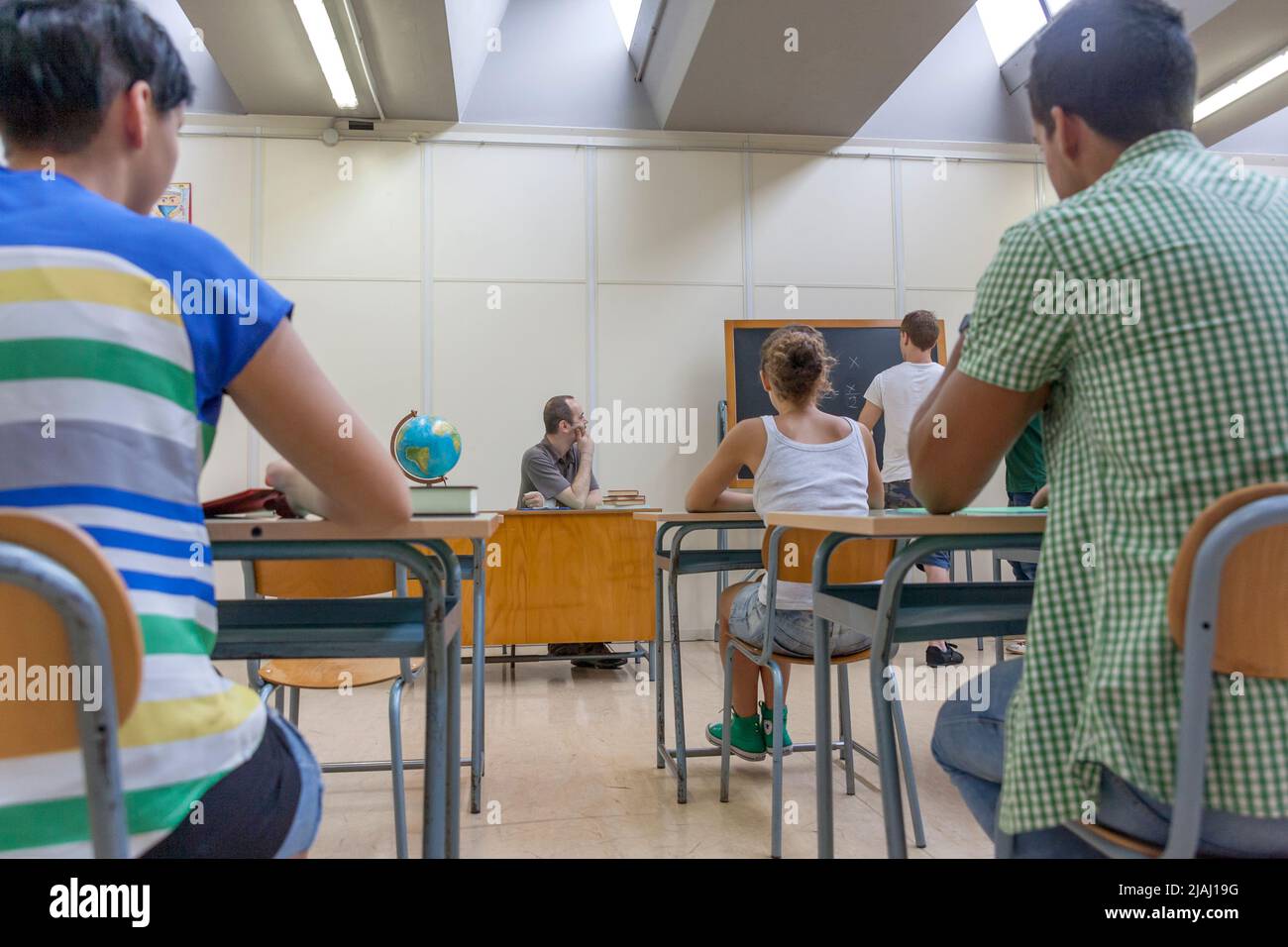 group of students follow the lesson in a classroom Stock Photo - Alamy
