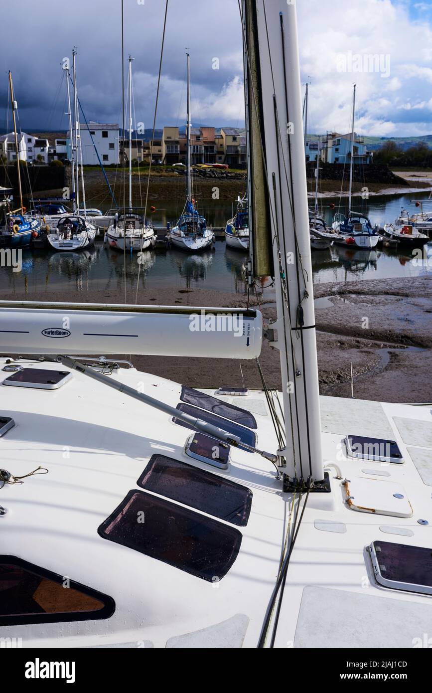 Yacht mast and boom and yacht deck close up with yachts at anchor at ...
